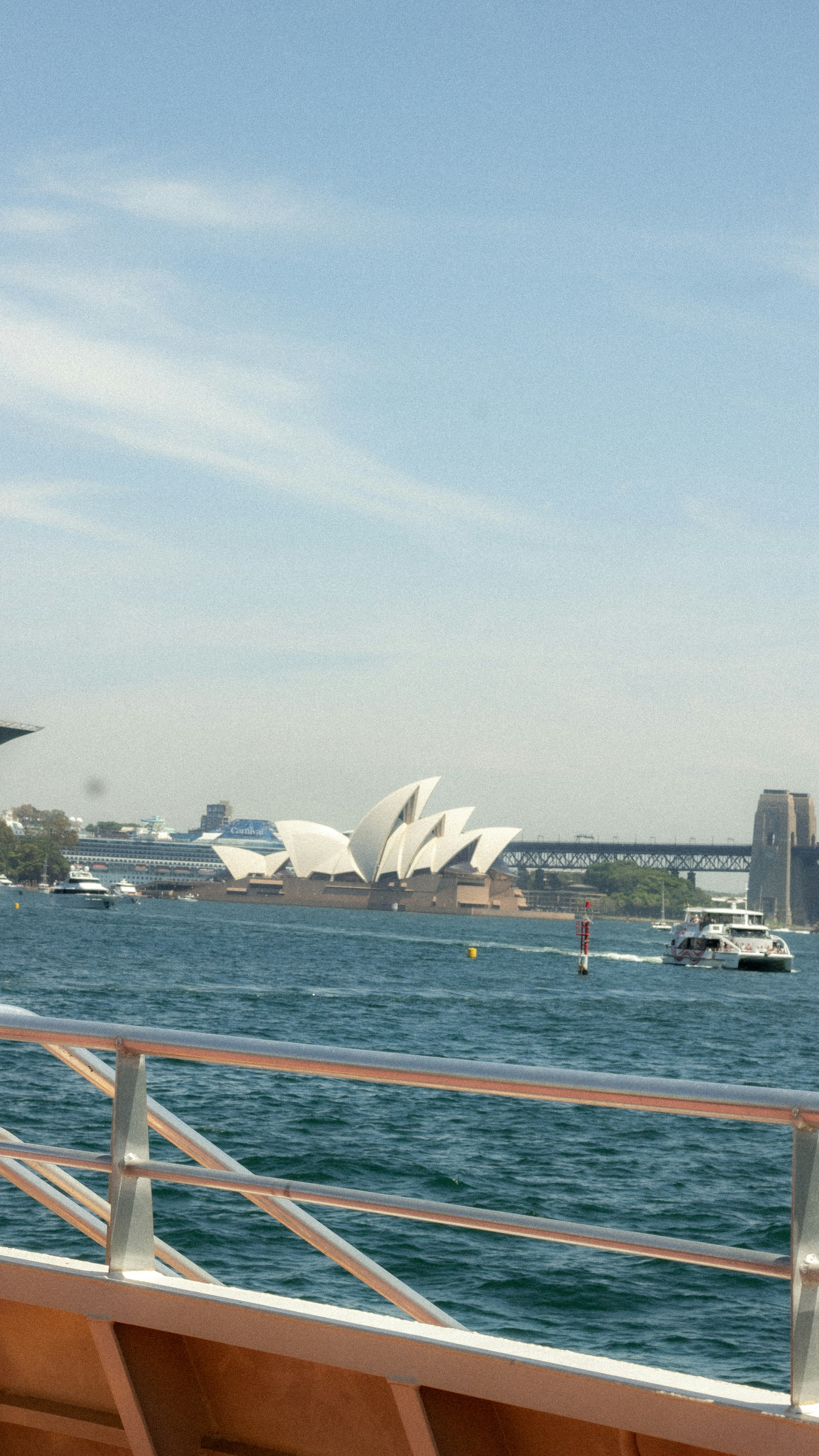 Sydney Harbour Vista: Opera House and Wharves in Side-Frame Light