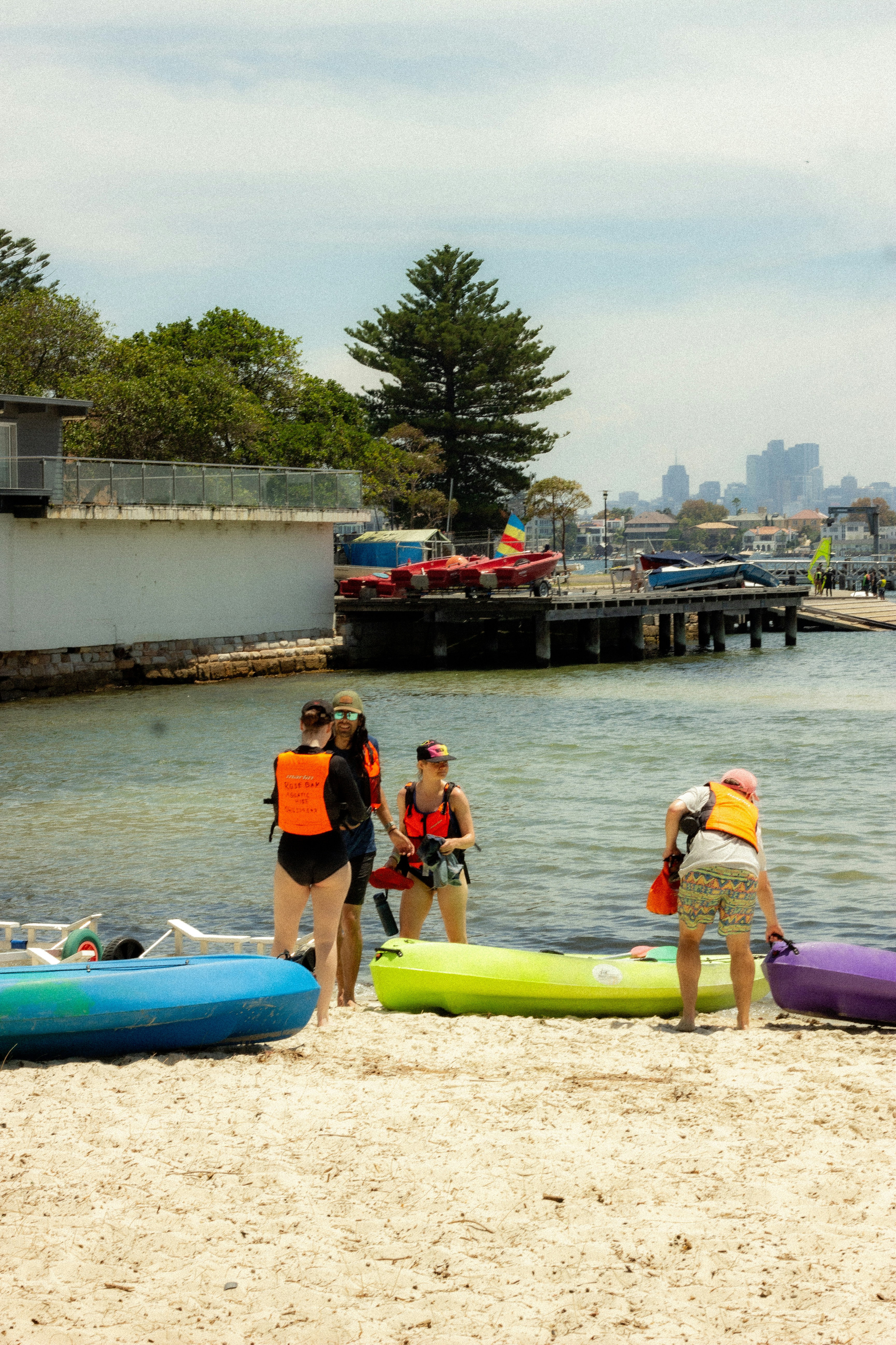 Beach Lifeguards and Kayaks at a Sunny Waterfront