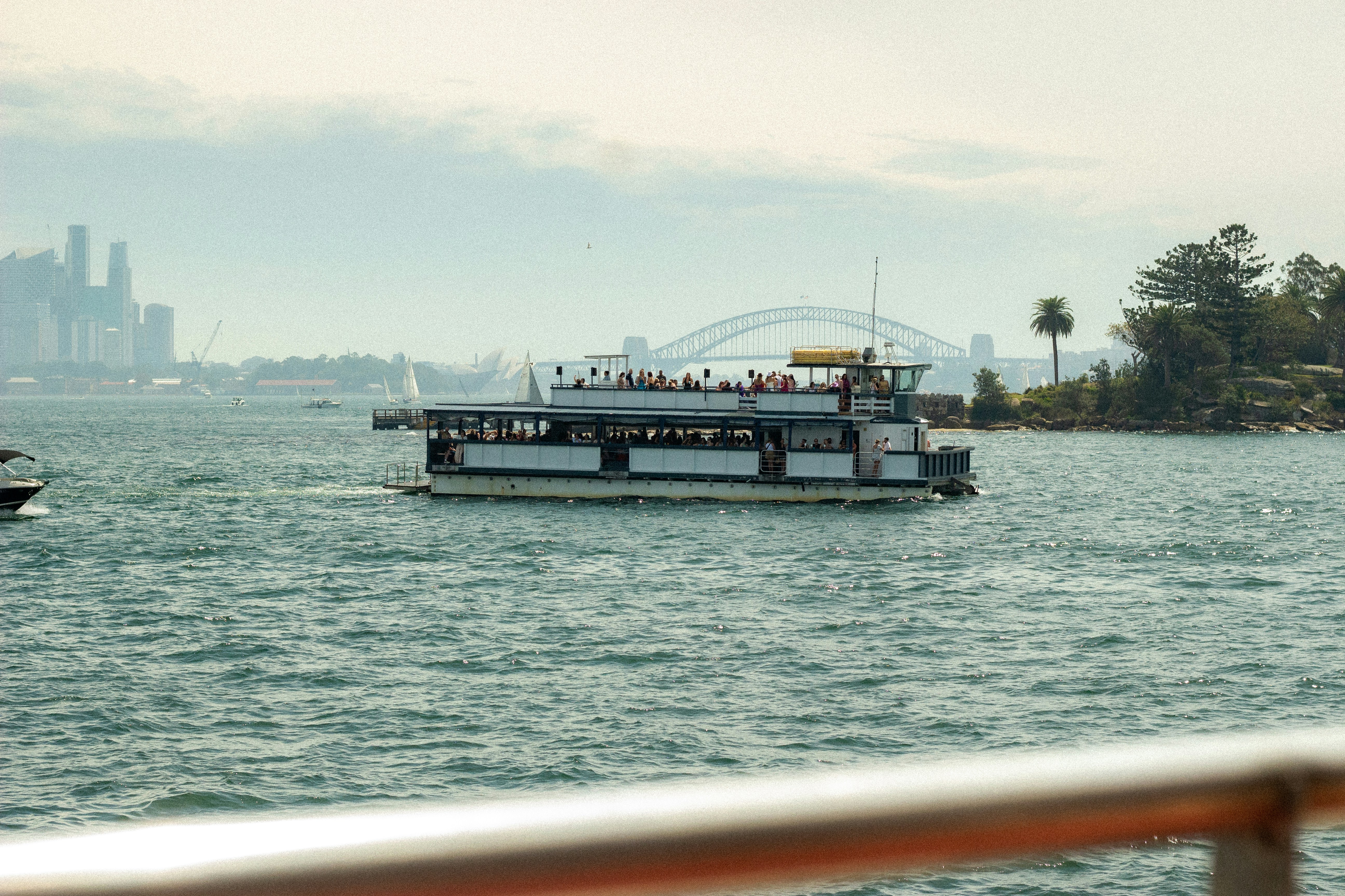  ferry cruise through Sydney Harbour: a plate of passengers on a two-deck boat