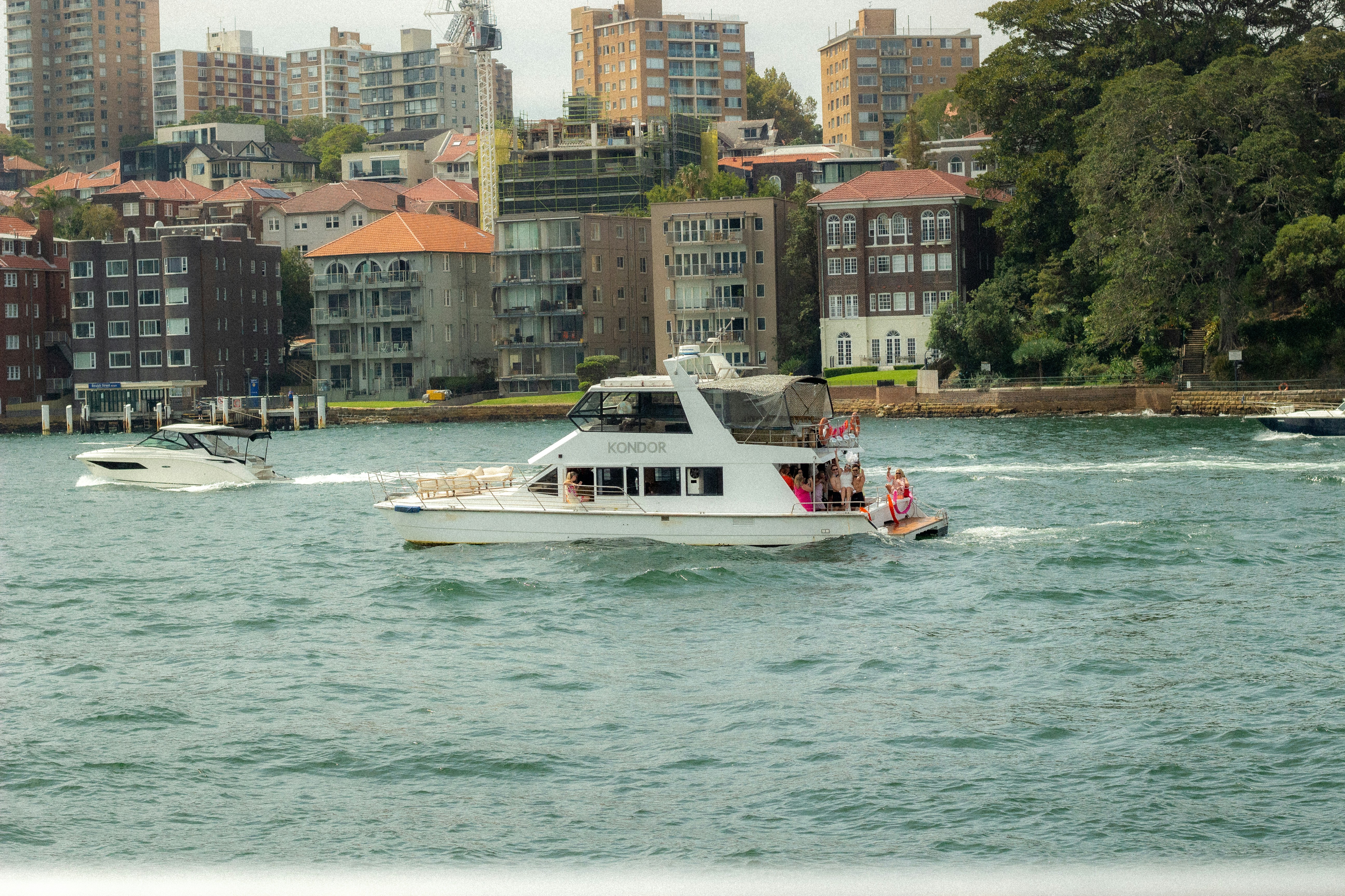 Port City Catamaran Gliding Past Riverside High-Rire