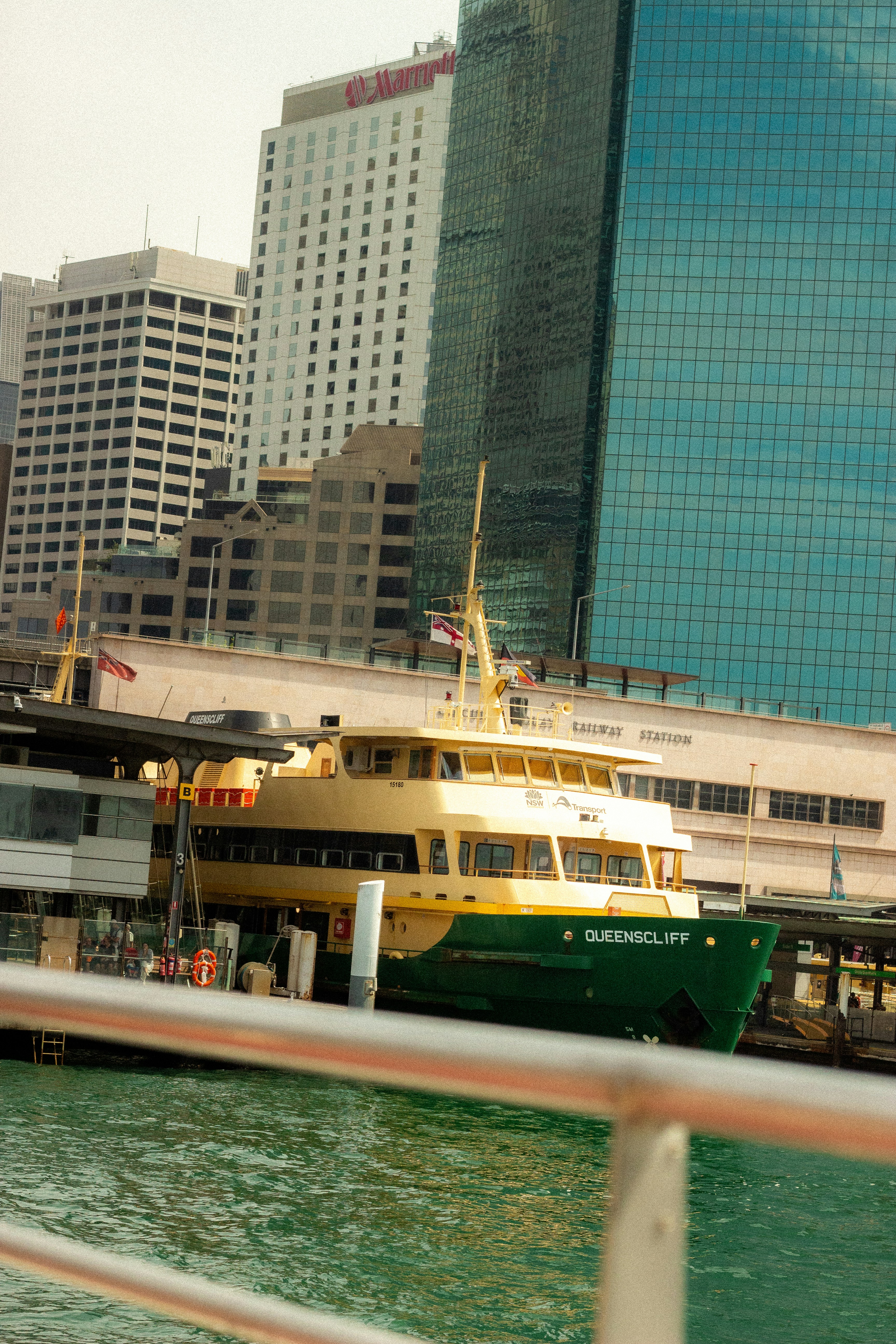 Queenscliff Ferry Sails Past the City Skyline