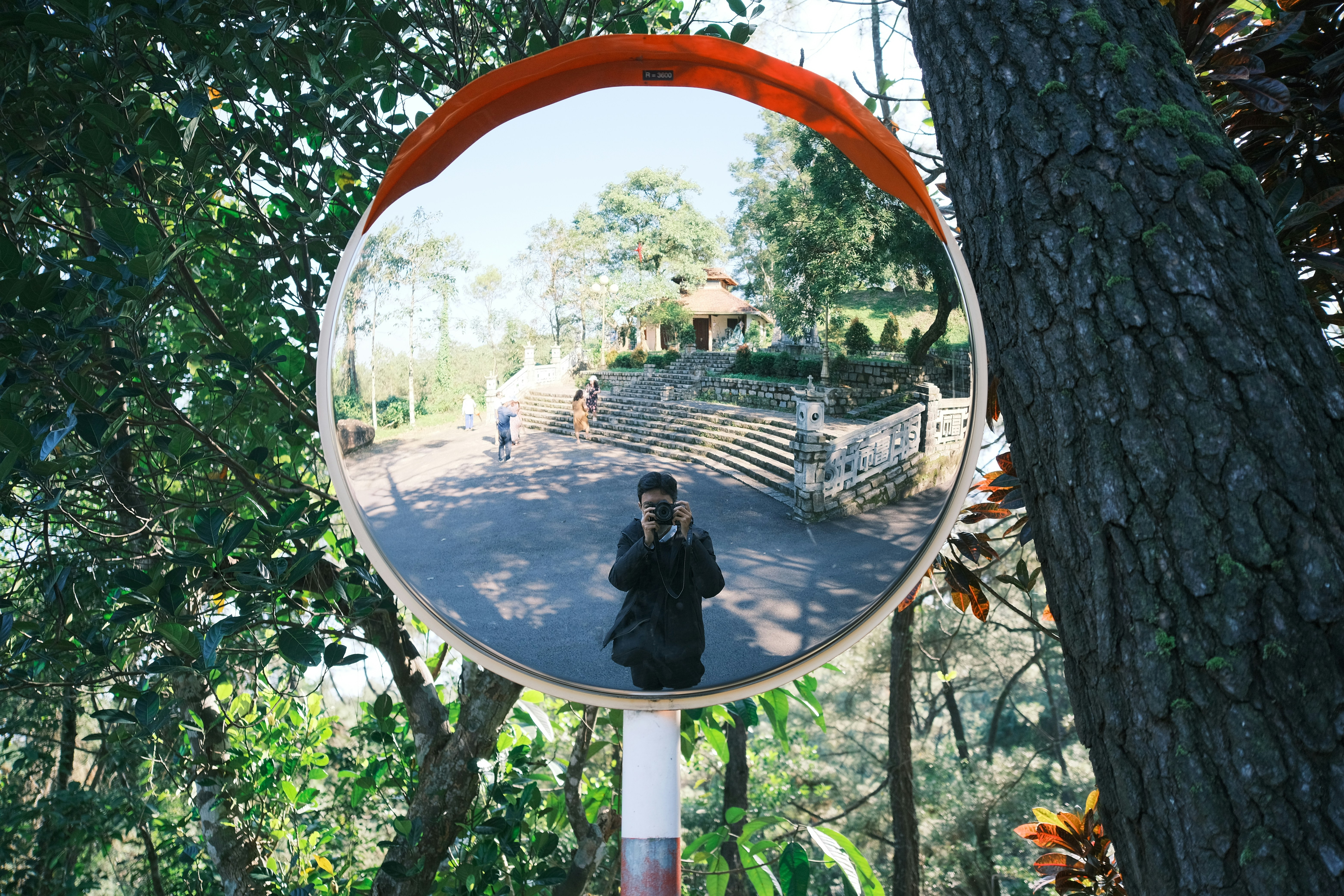 Mirror in the Garden: A Photographer's Reflection at the Park Gate
