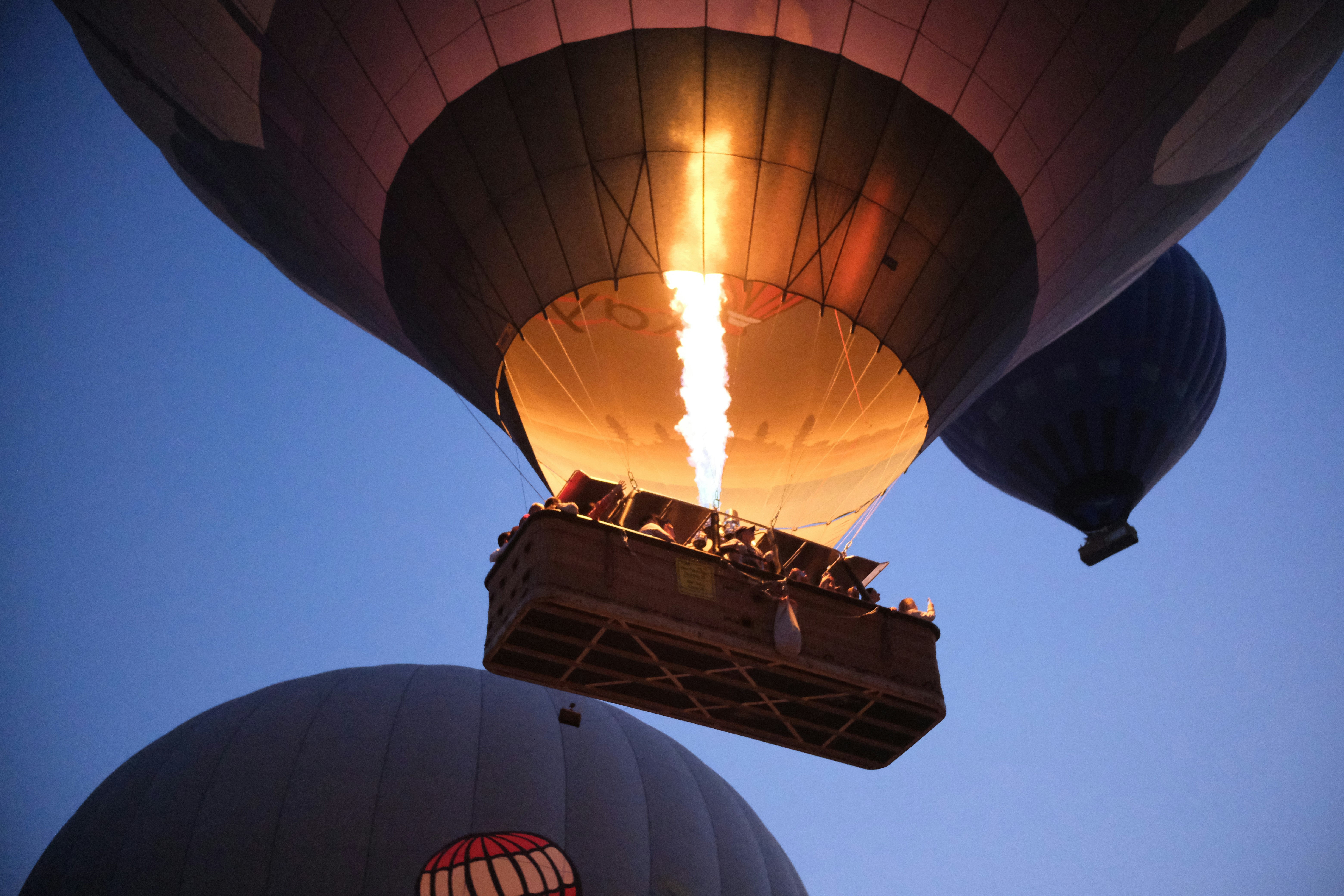 Fireflight in the Sky: A Balloon Lift-Off Under a Blue Dusk