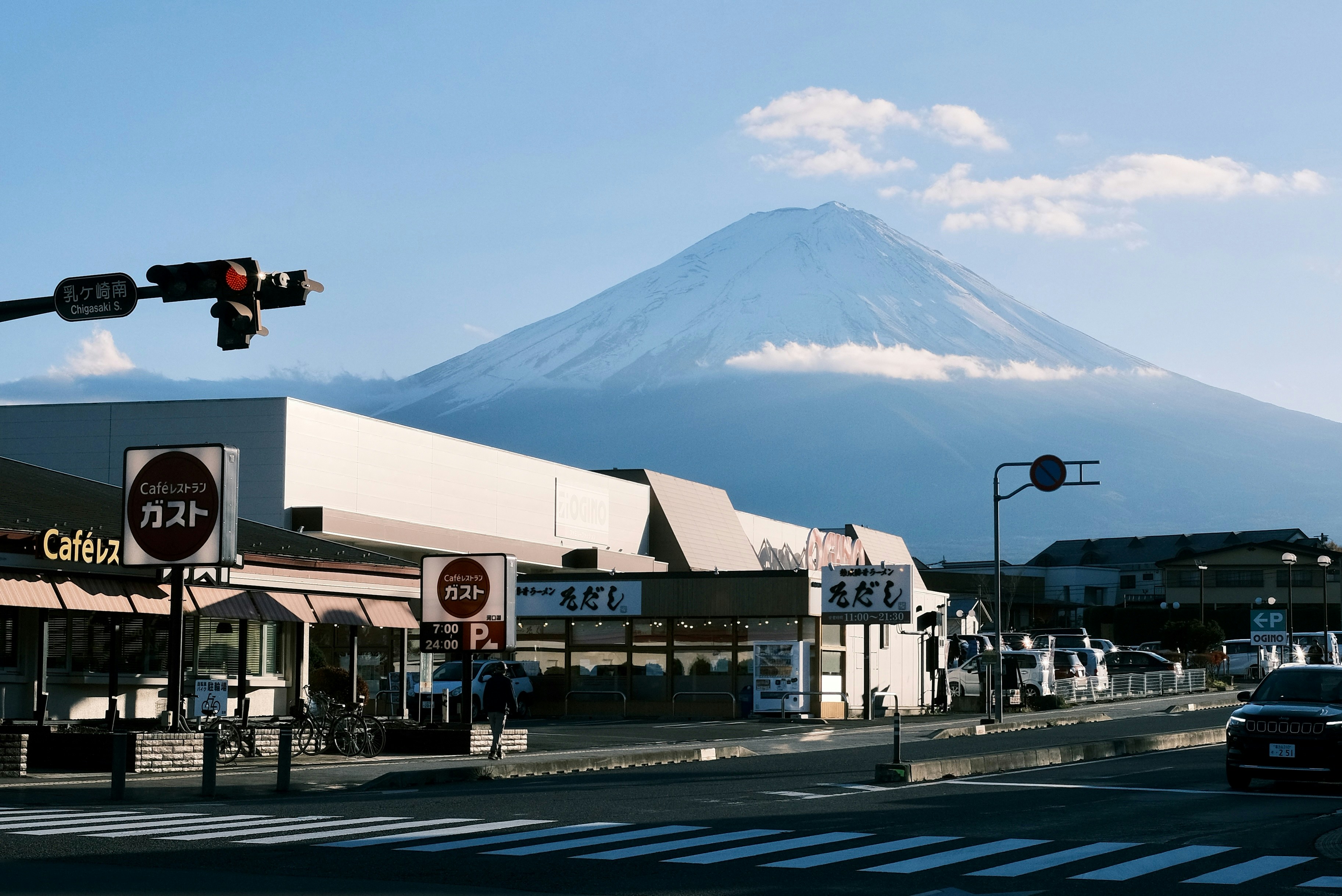 Mt. Fuji on the Edge: Street Scene with a Snow-Capped Peak in Quiet Blue Light