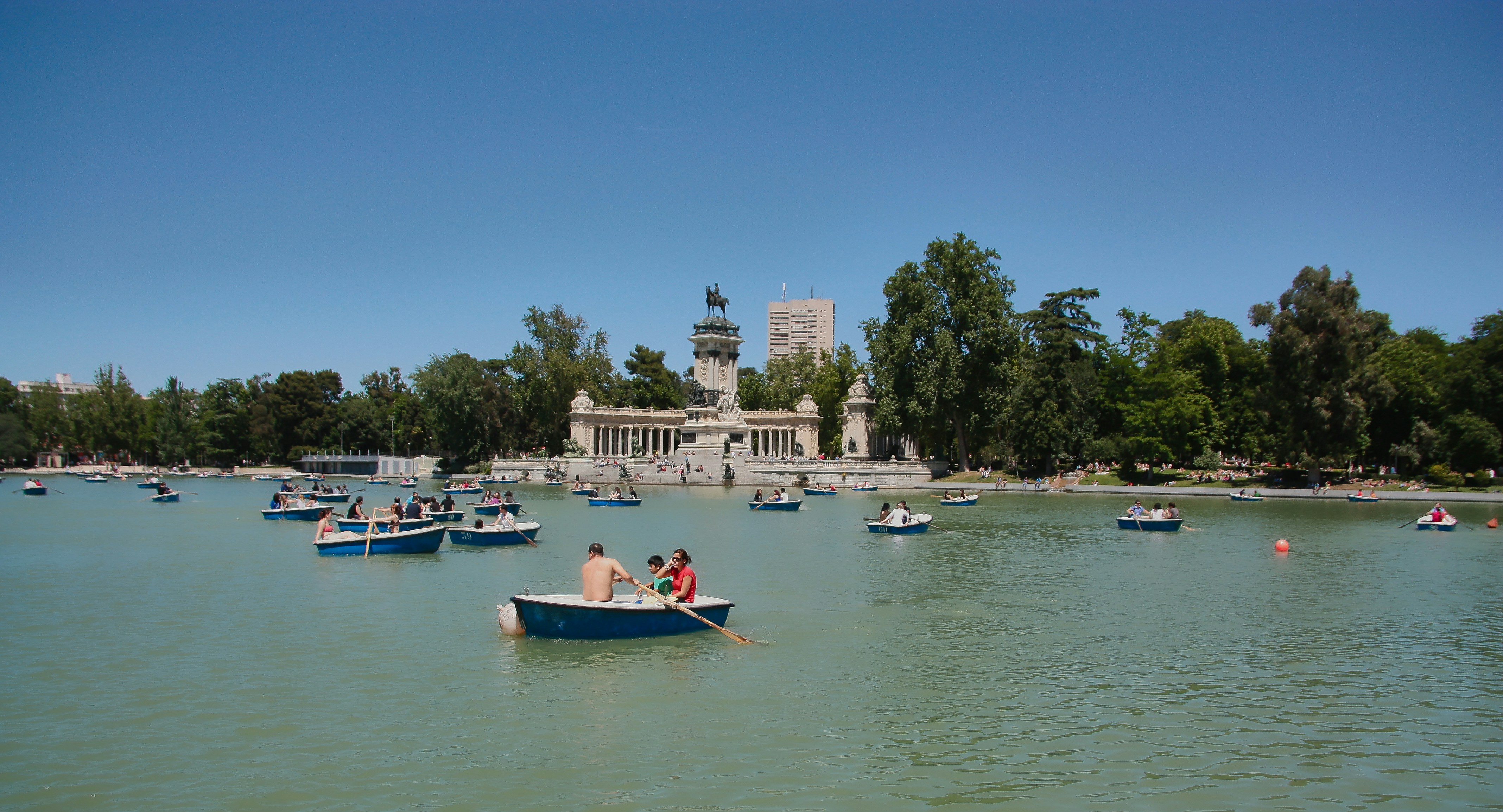 Waterborne Mosaic: Boats Scatter the Calm Madrid Park Lagoon