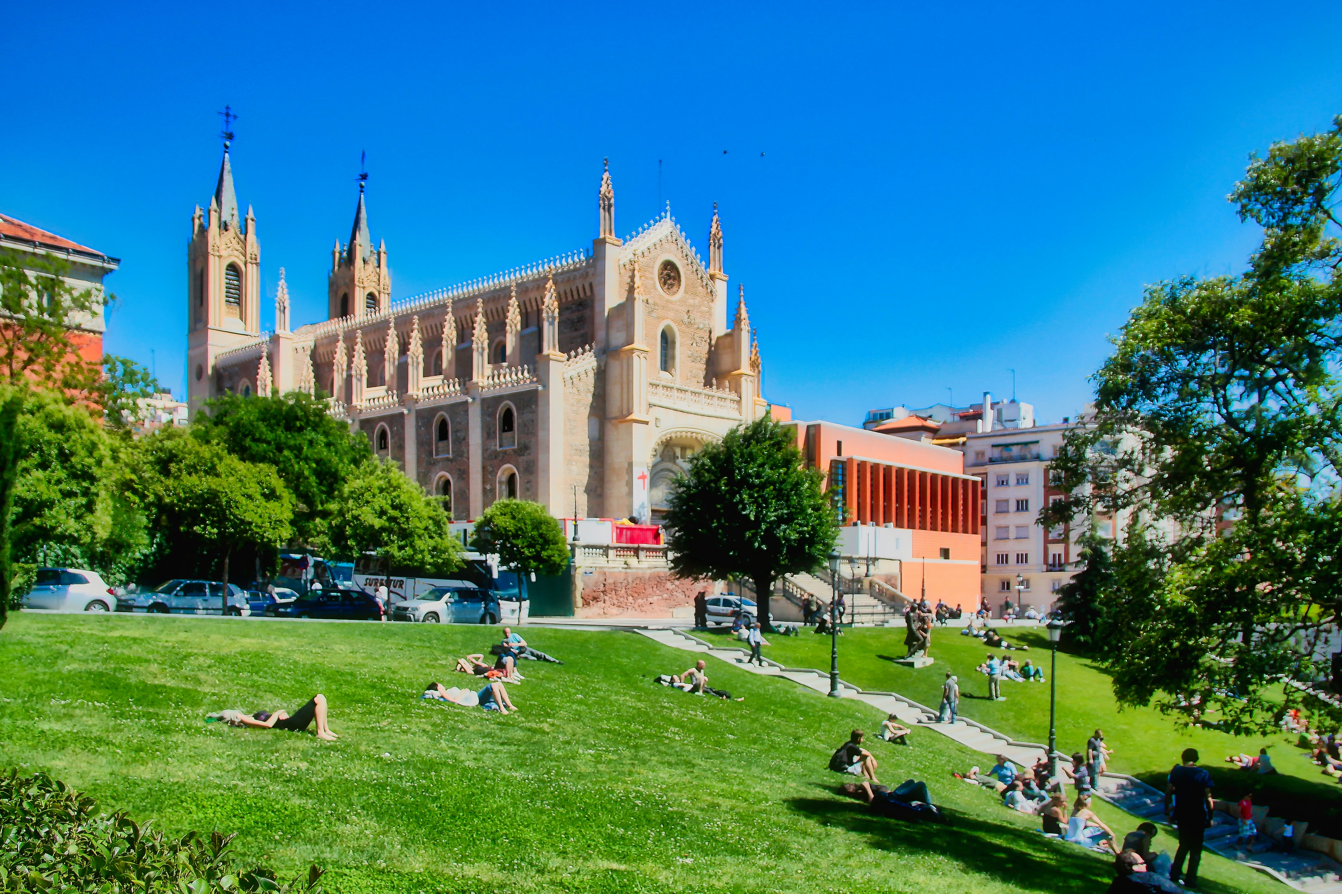 Cathedral by the Hill: Sunlit Gothic Spine Over a Lively Park