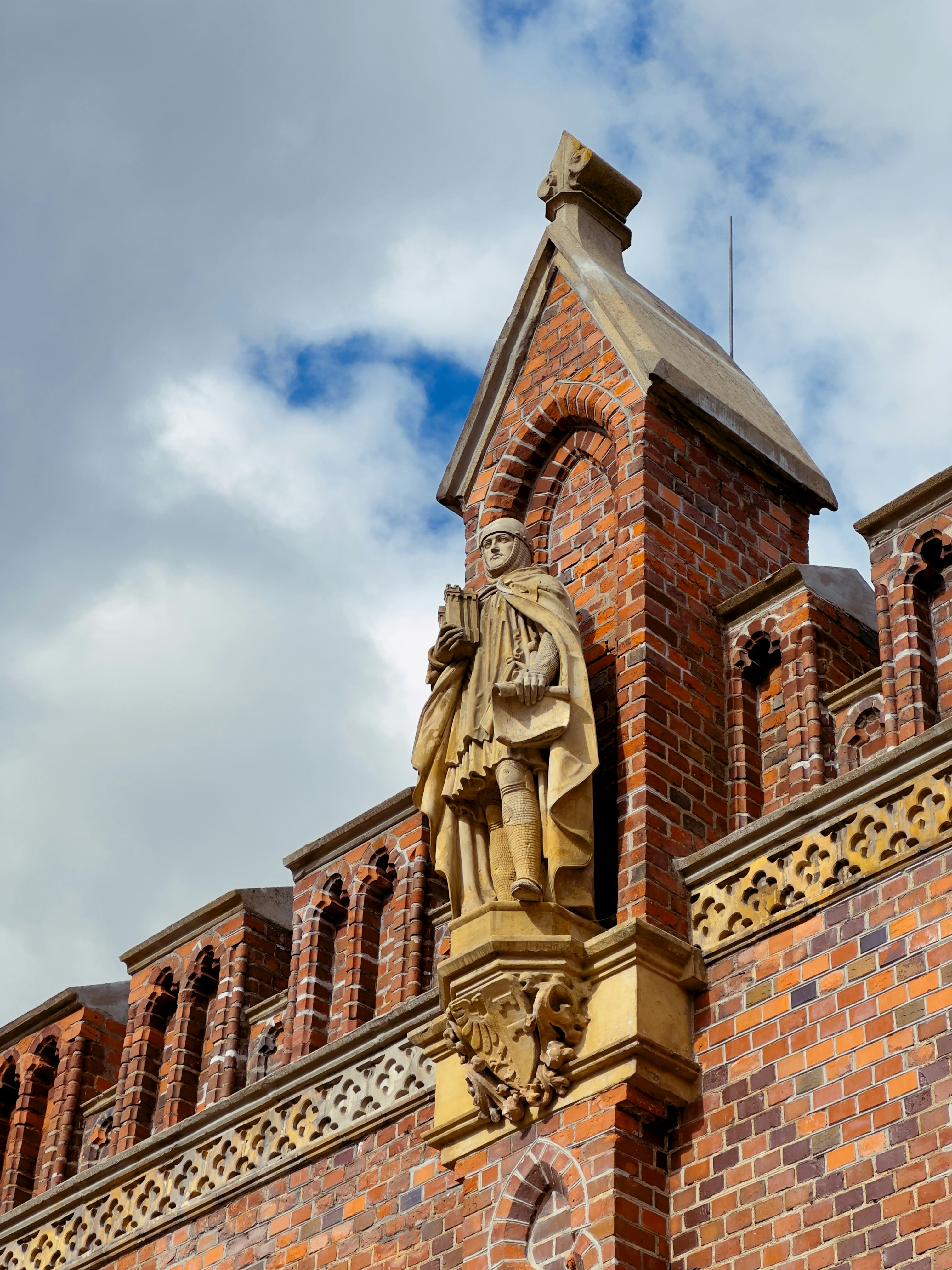 Stone Ornament on a Red Brick Cathedral