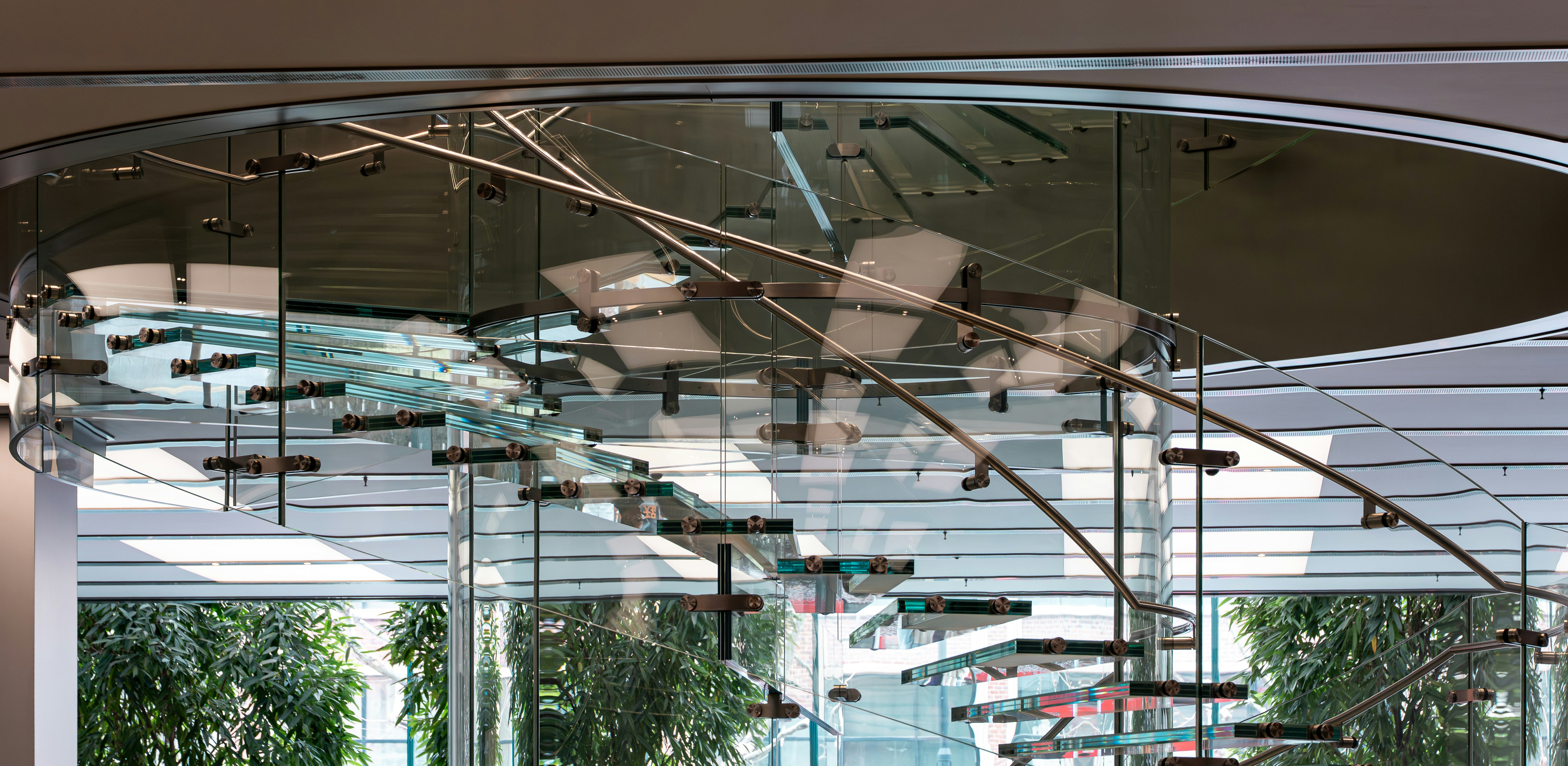 Glass Staircase Reflections in a Modern Atrium
