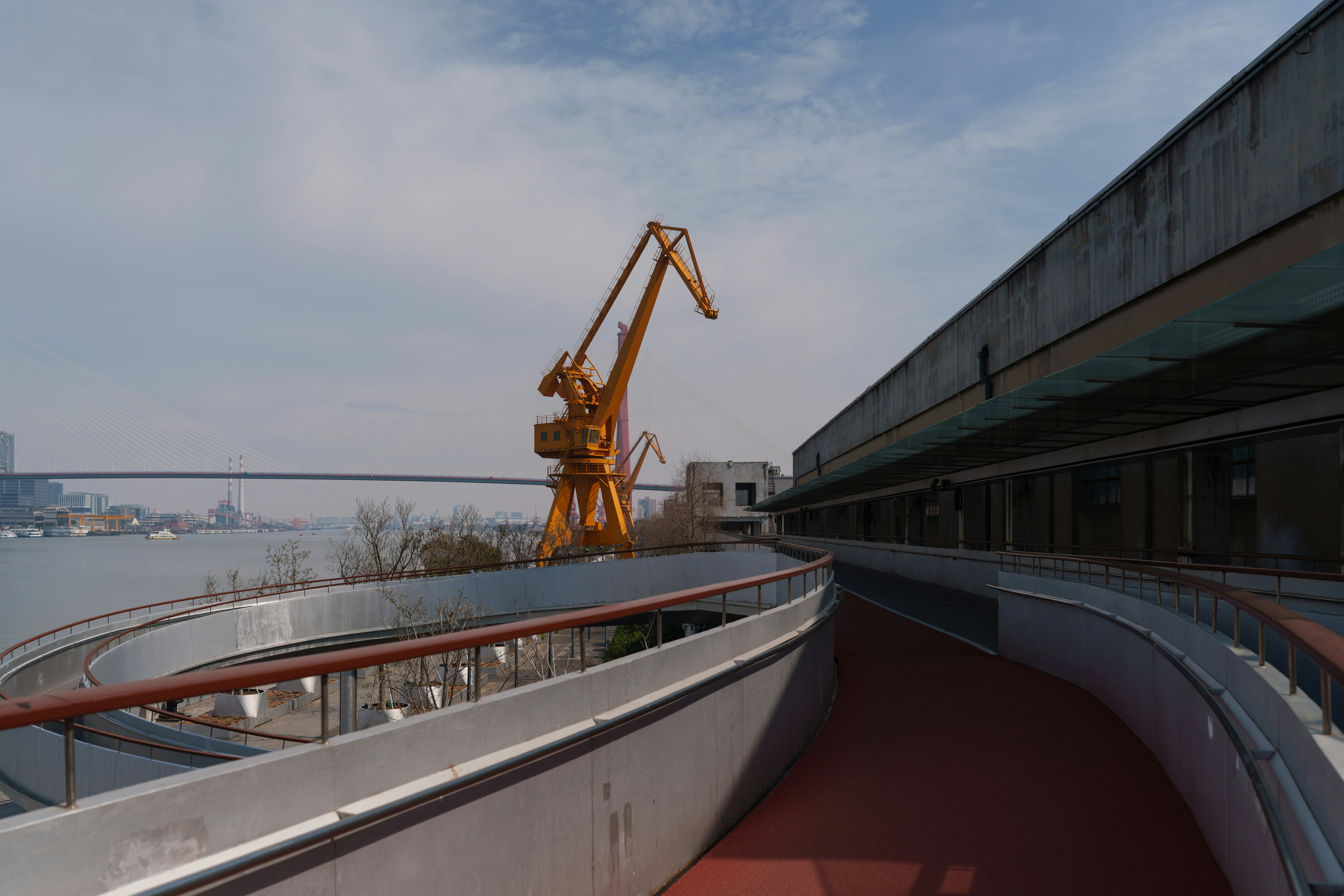 Harbor Crane Over the Curving Promenade