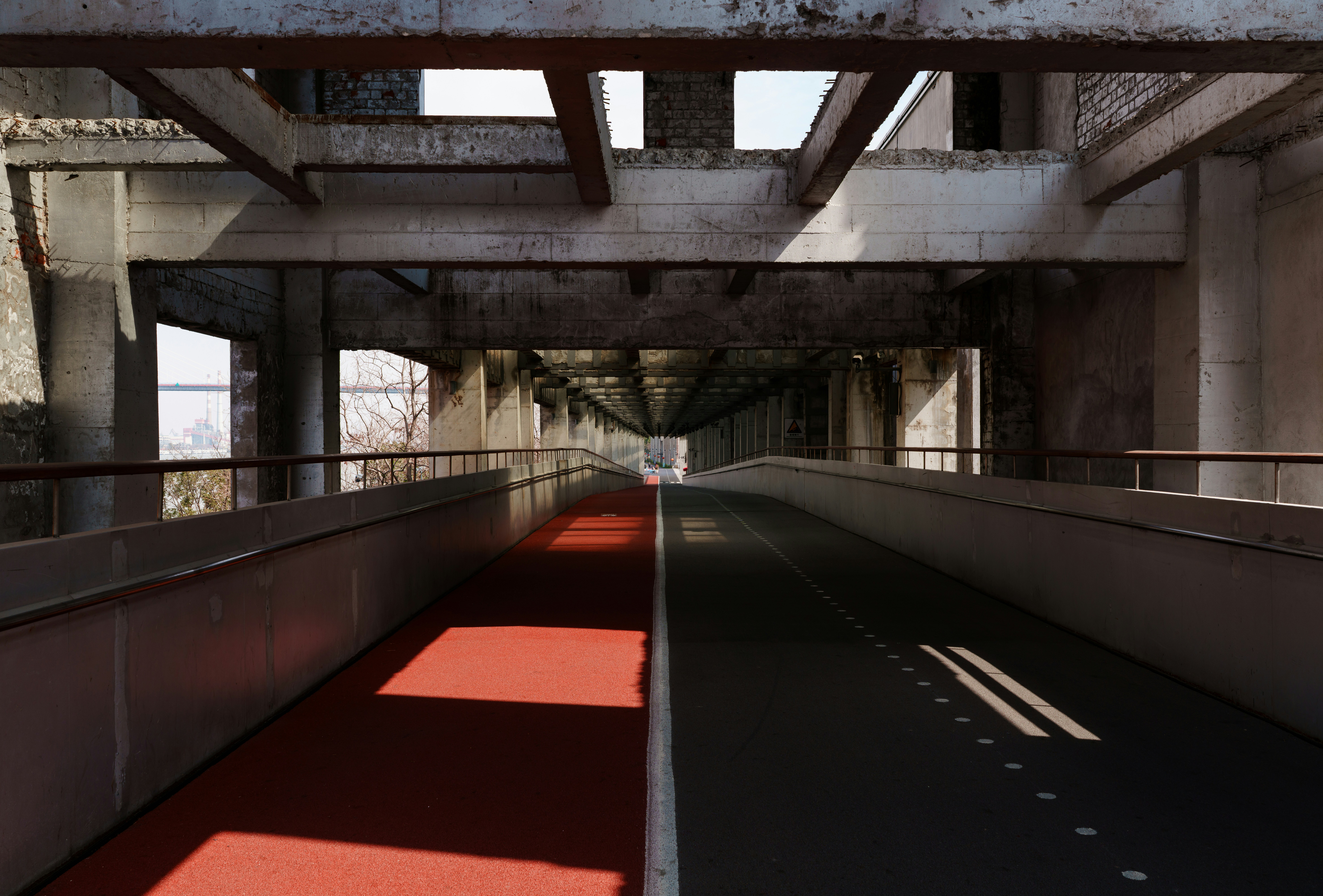 Underpass Corridor: A Red-Cilled Path to Light
