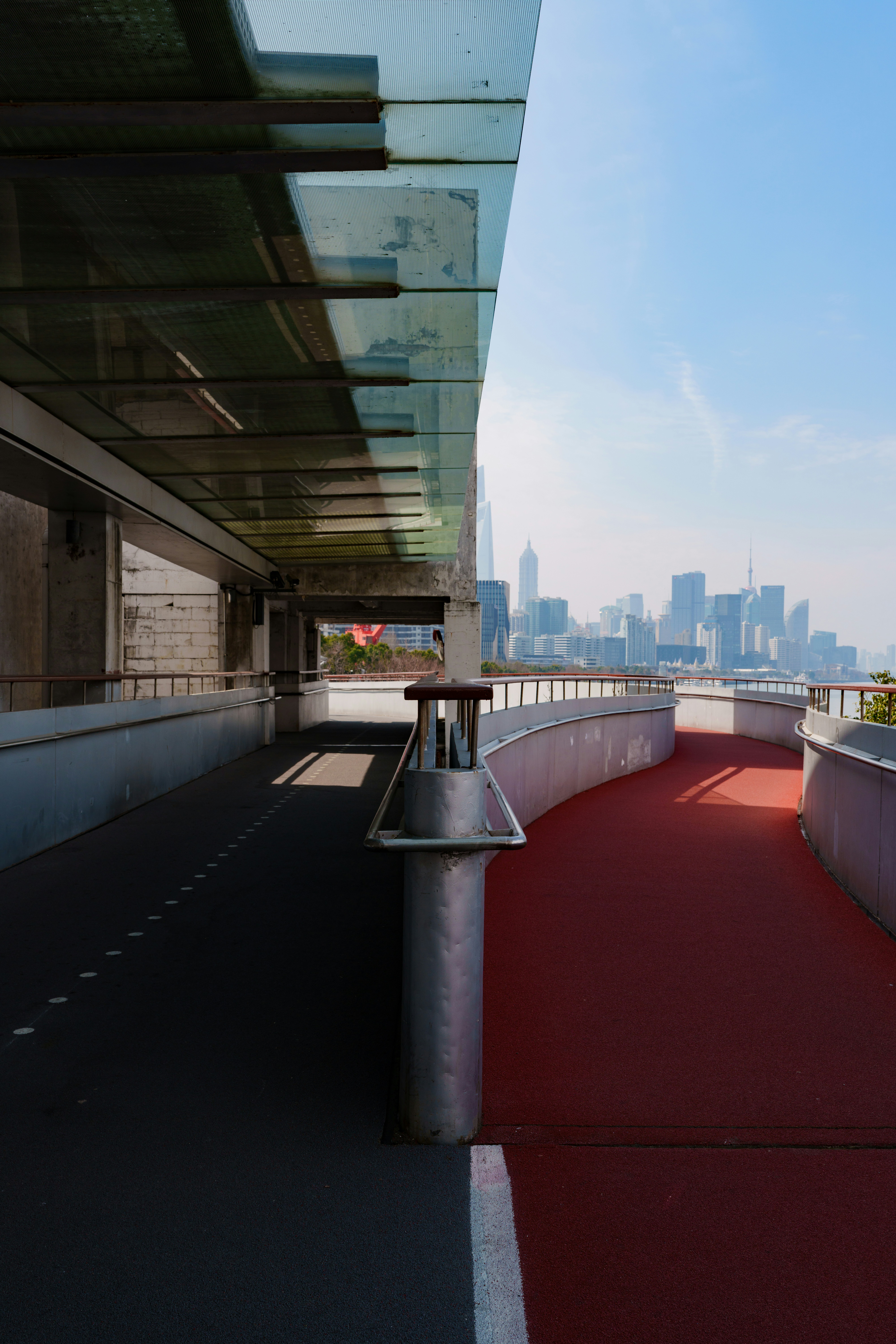 City Horizon from the Ascent: Red Path and Glass Canopy