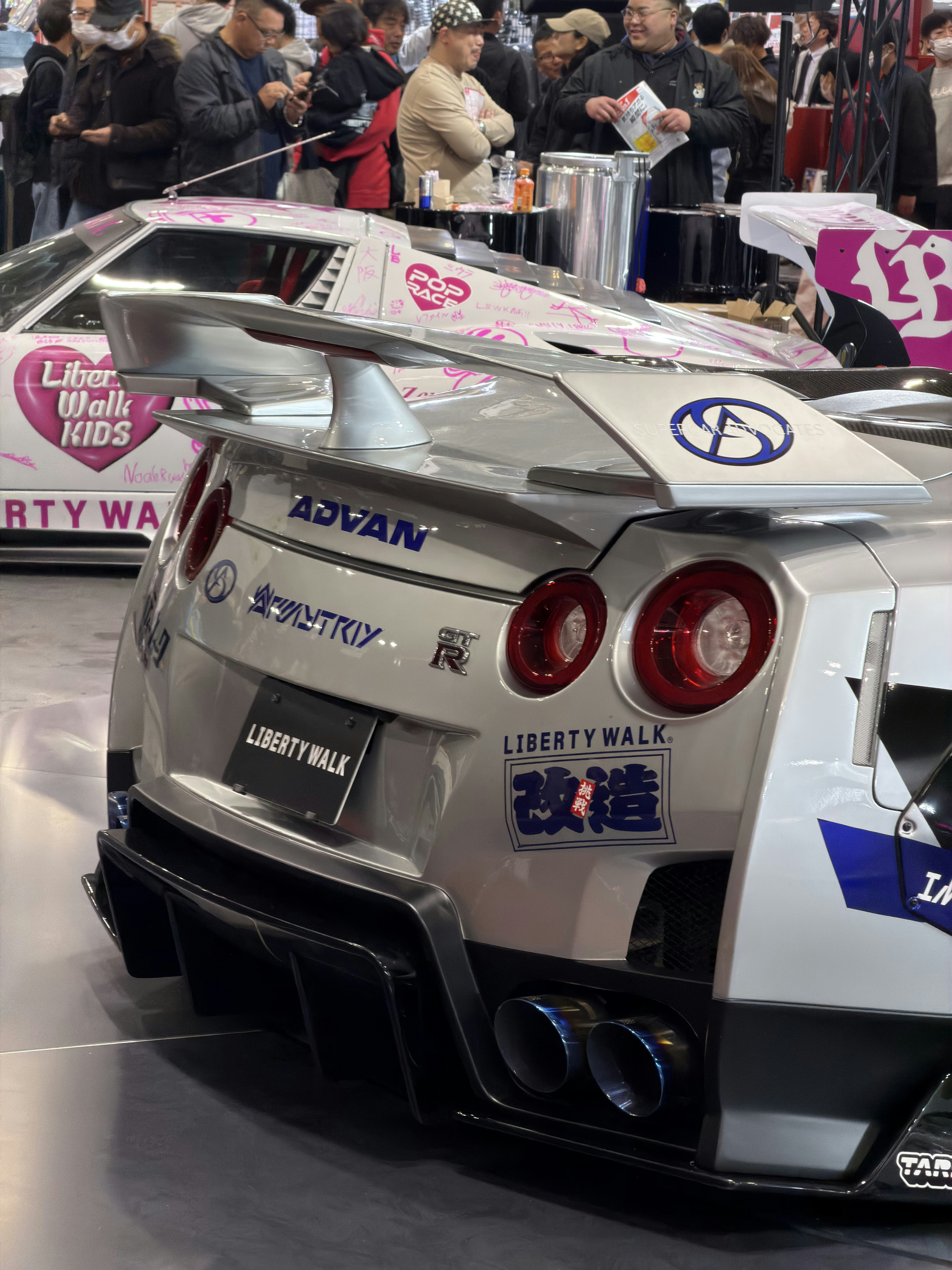 Rear Turbocharger Glare: A Juxtaposition of Exotics at the Car Show