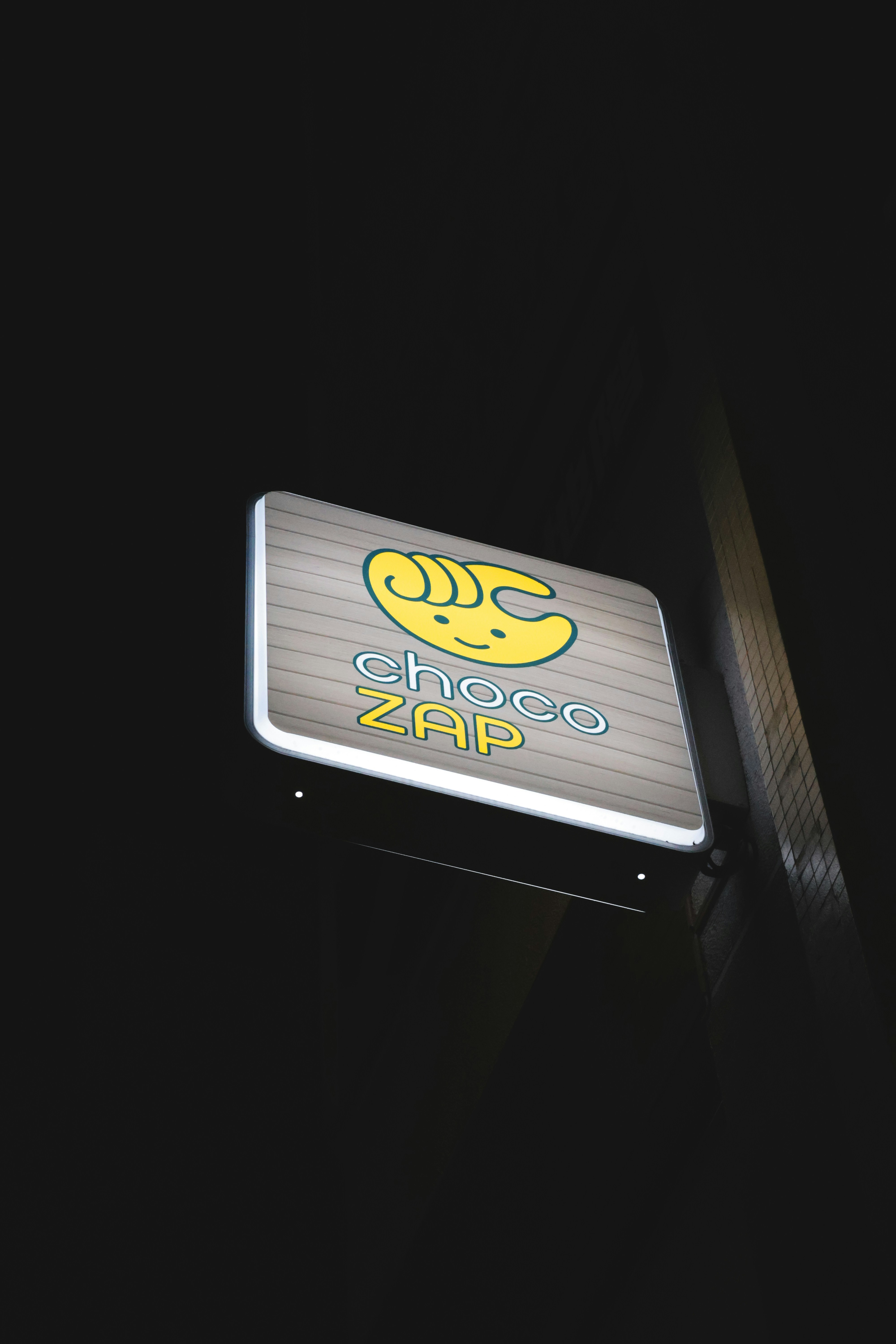 Luminous Crest: Choco Zap Signilluminated at Night