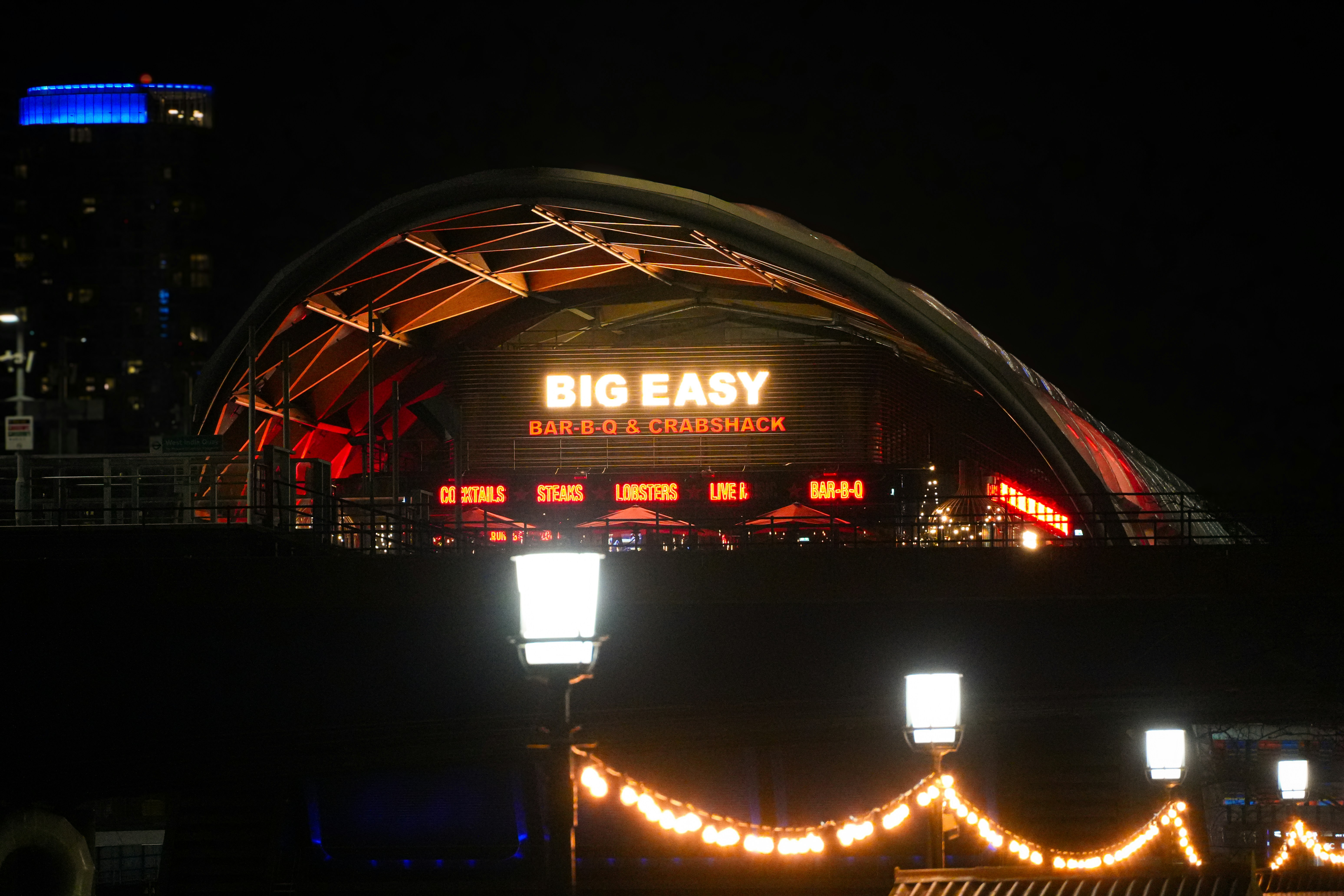 Night Beacon Over the Arched Canal: BIG EASY Sign in Neon Glow