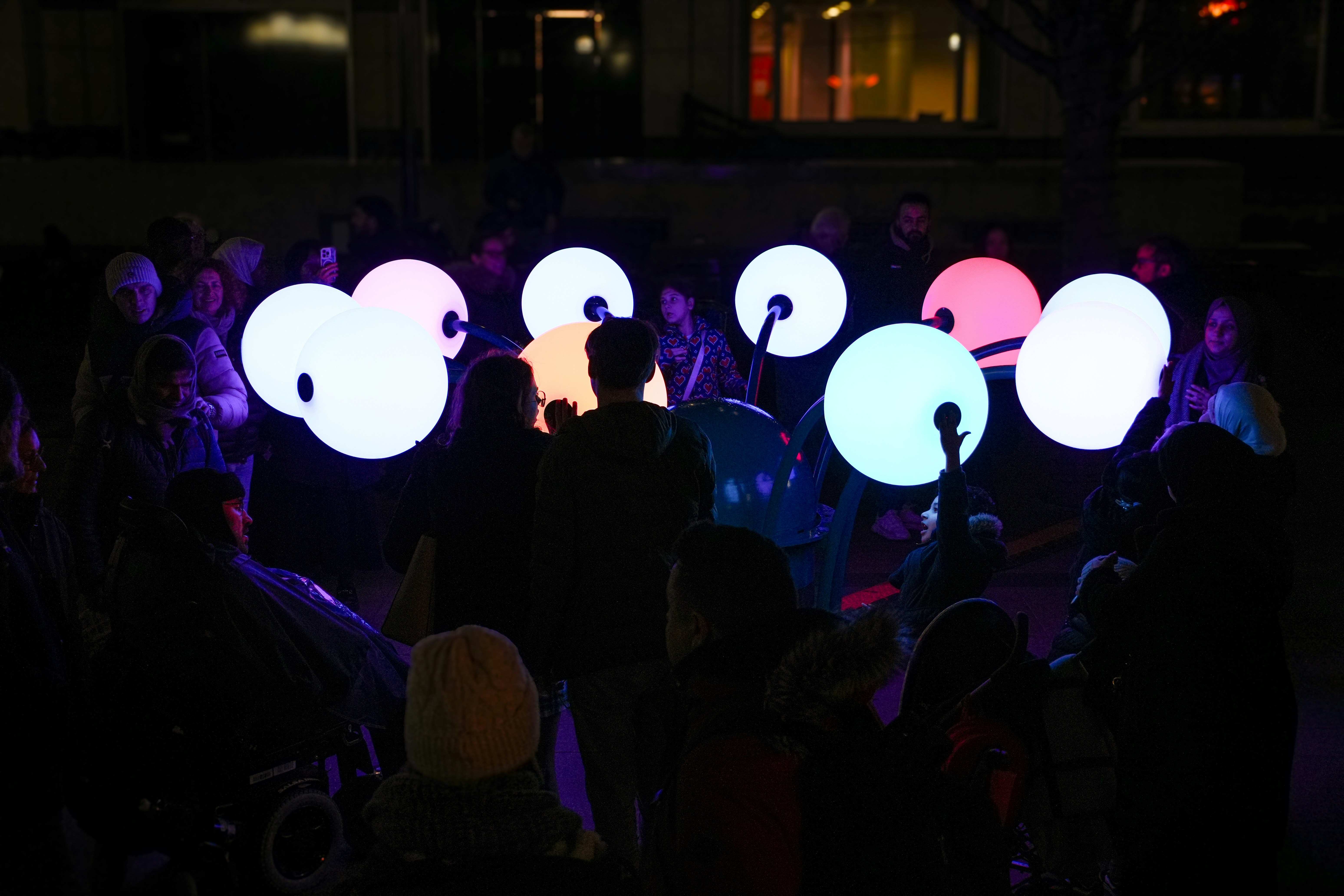Glowing Orbs and a Circle of People