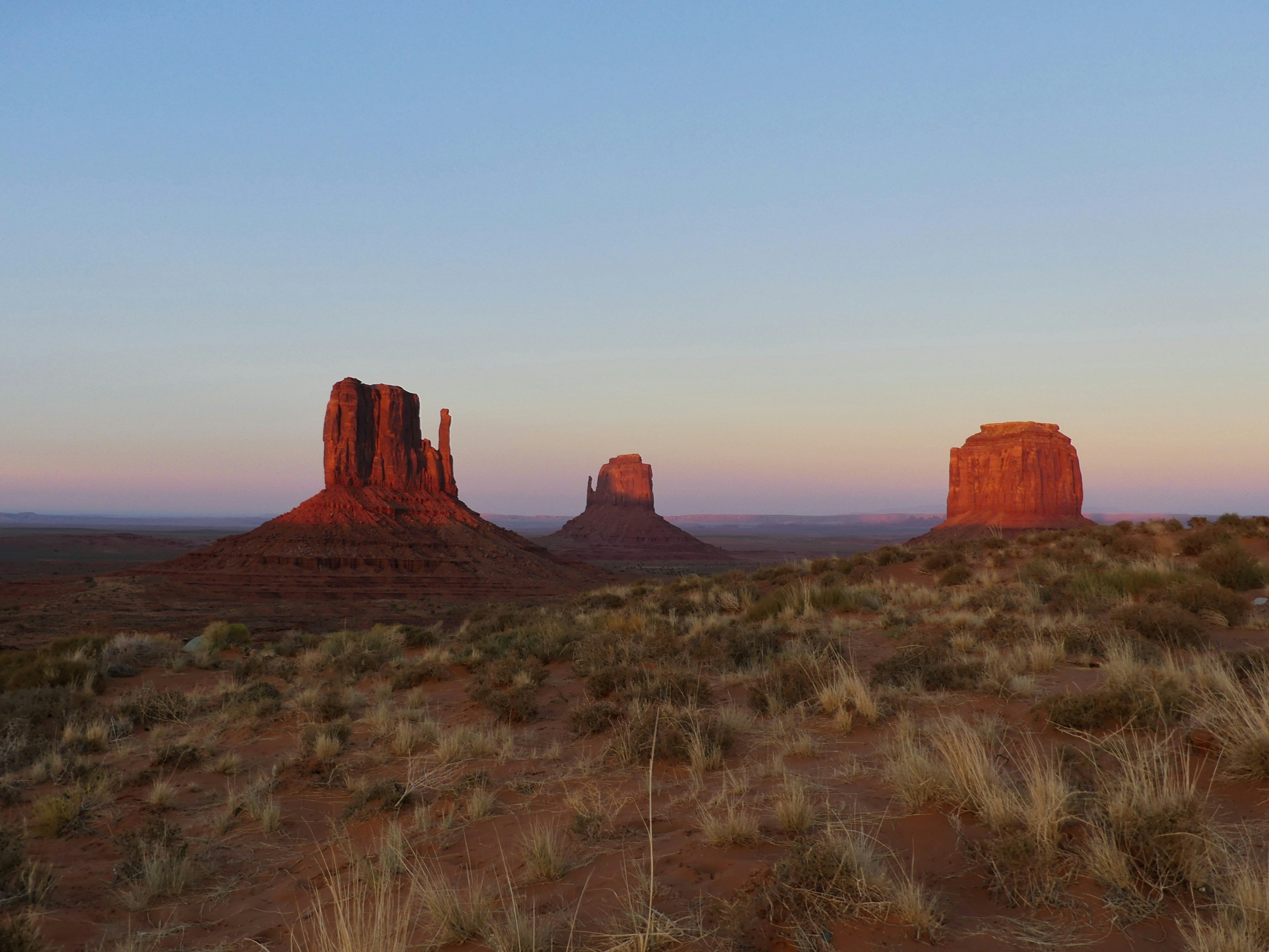 Evening Monoliths: A Plateau Desert Sunset Over Monument Valley