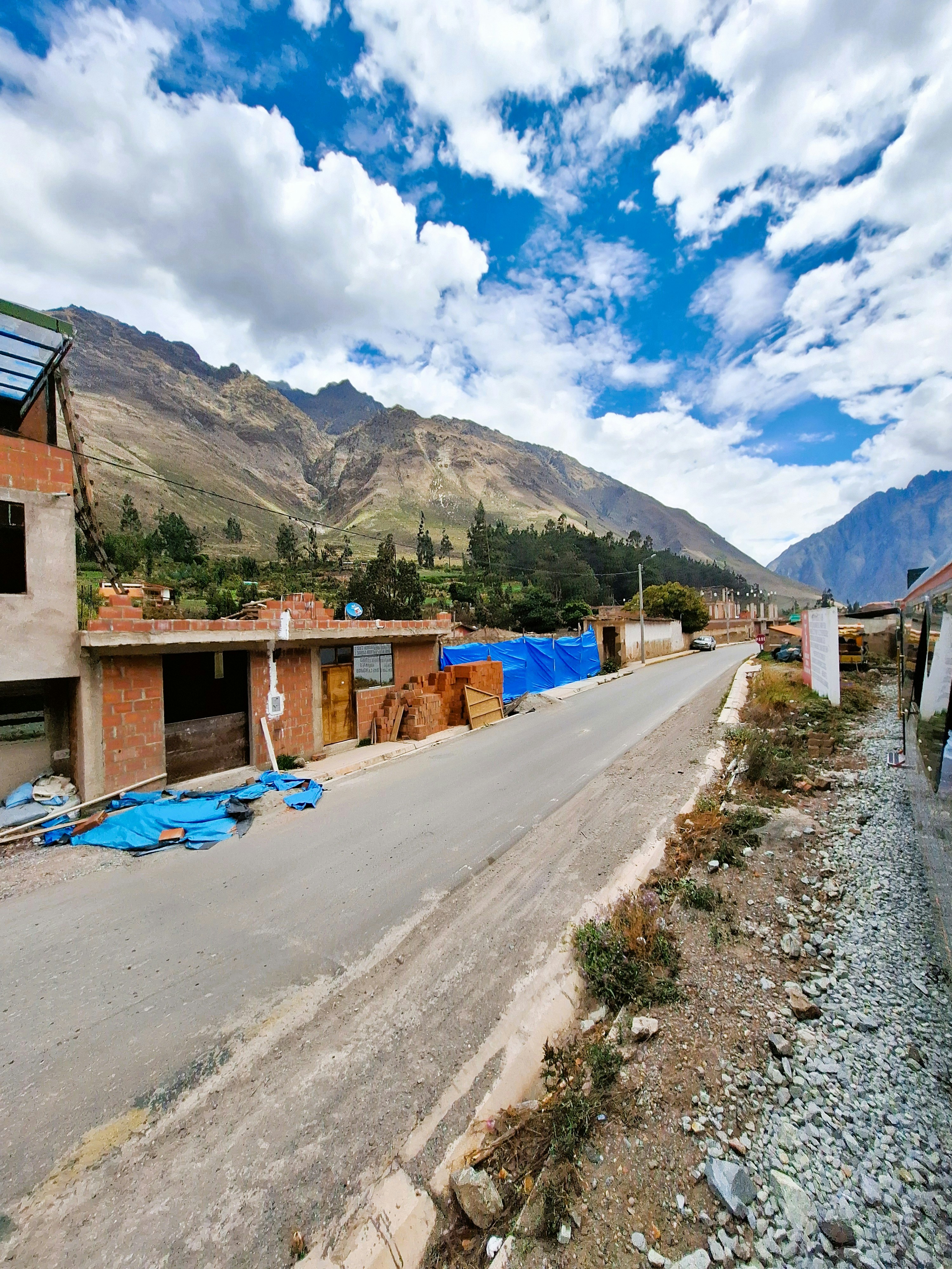 Rural Mountain Street Under a Wide Blue Sky