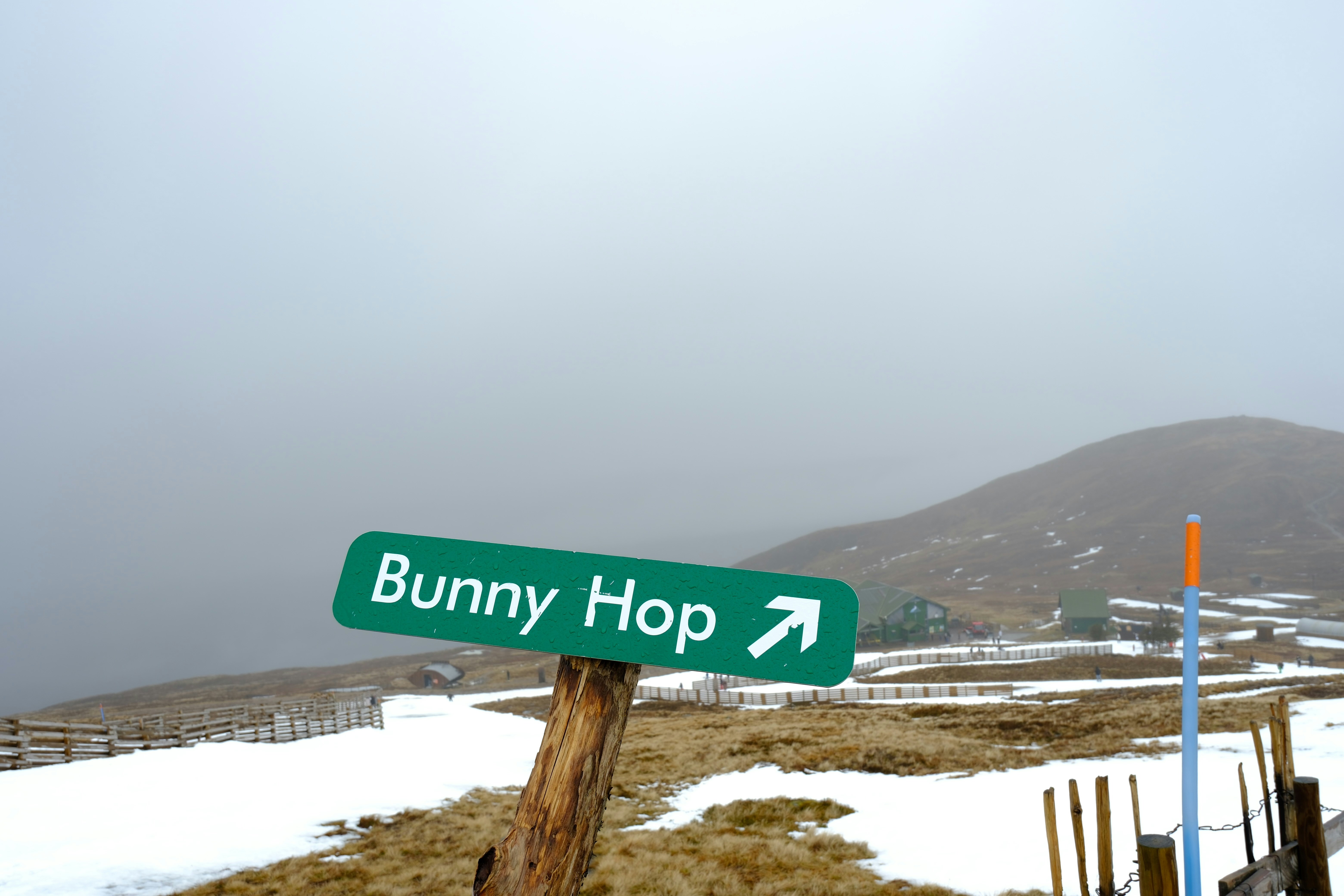 Bunny Hop Trail Sign Against Winter Ridge