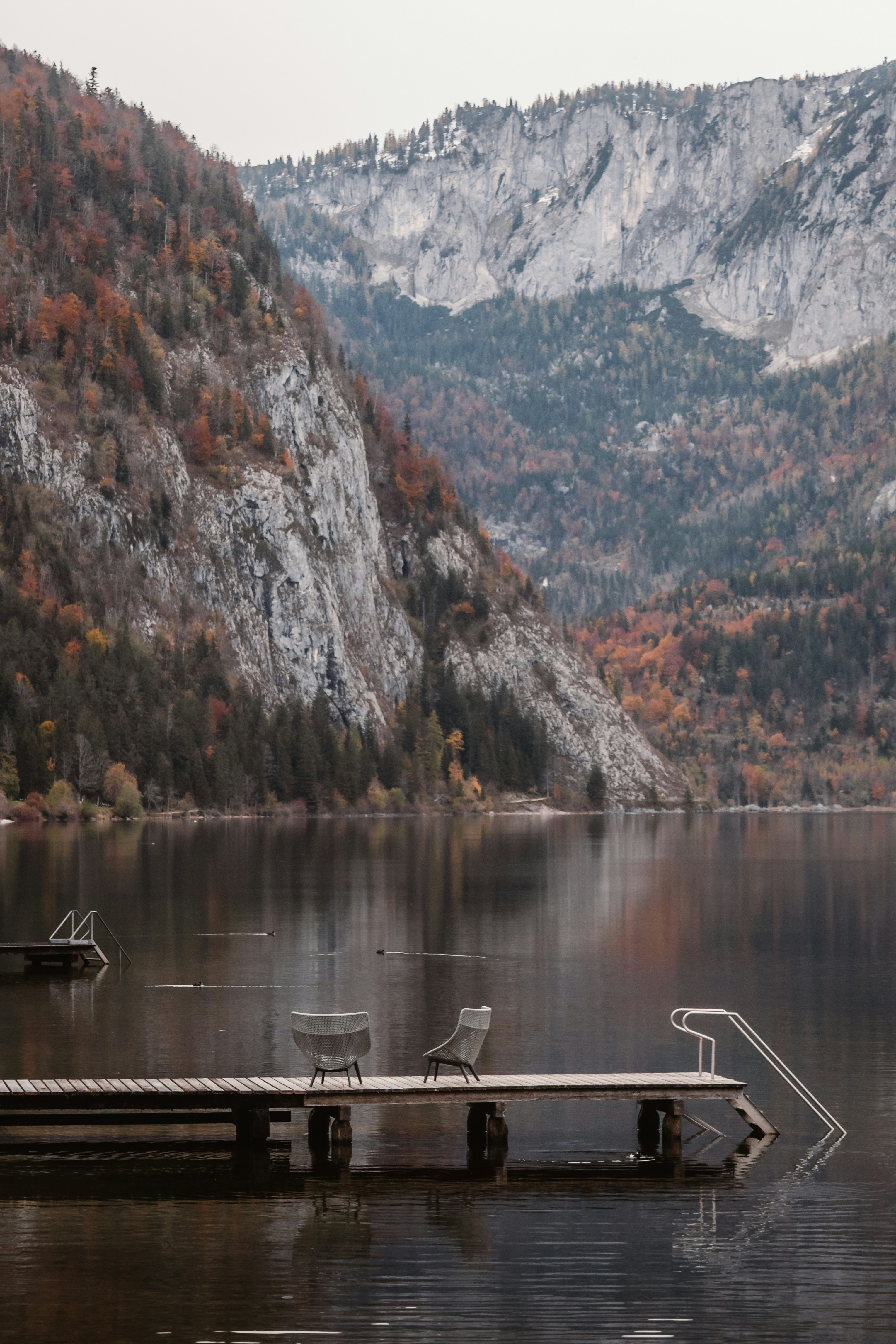 Lonely Dock Fringed by Fjordic Peaks at Dusk