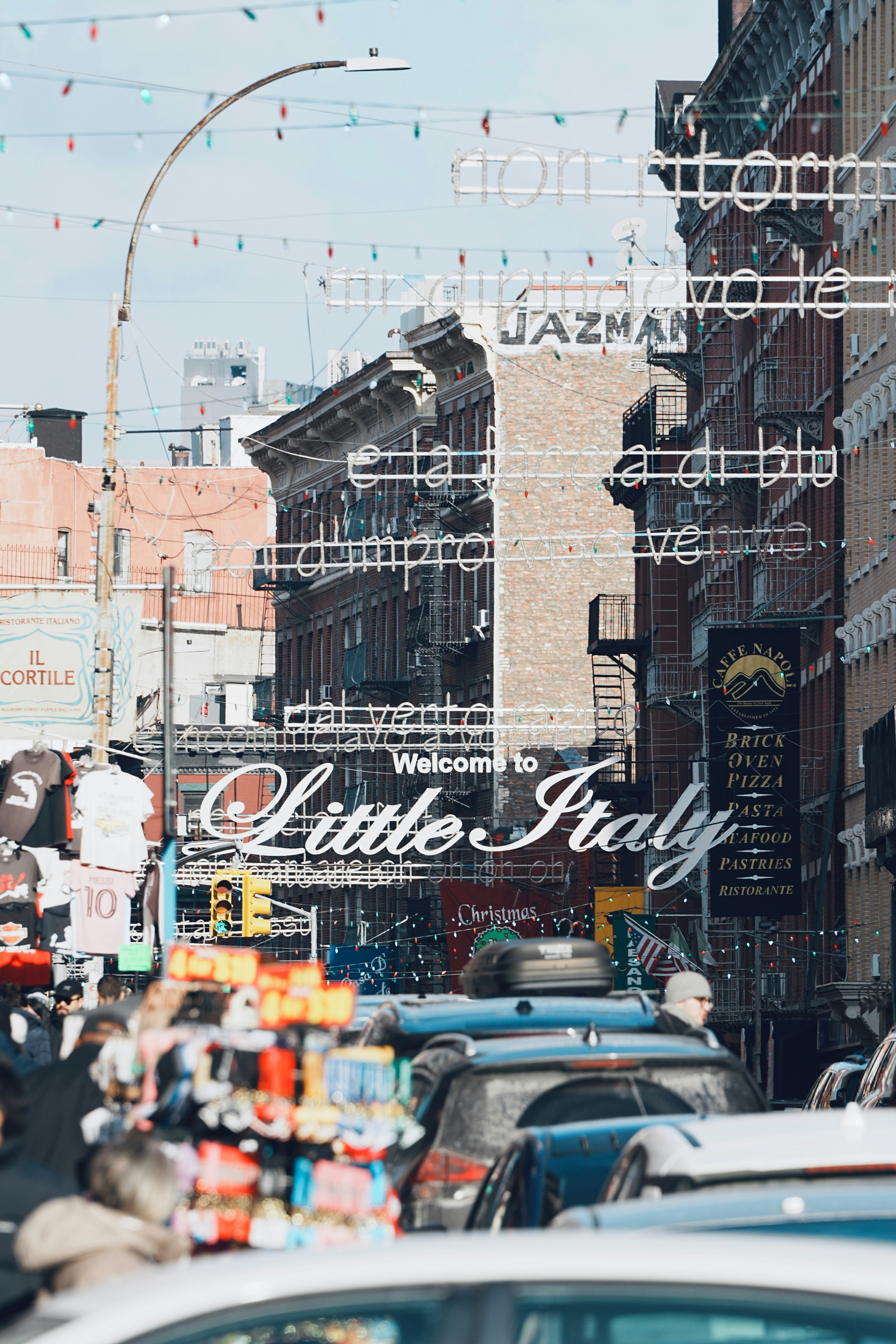 Welcome to Little Italy: Neon Signs, Street Traffic, and Holiday Lights