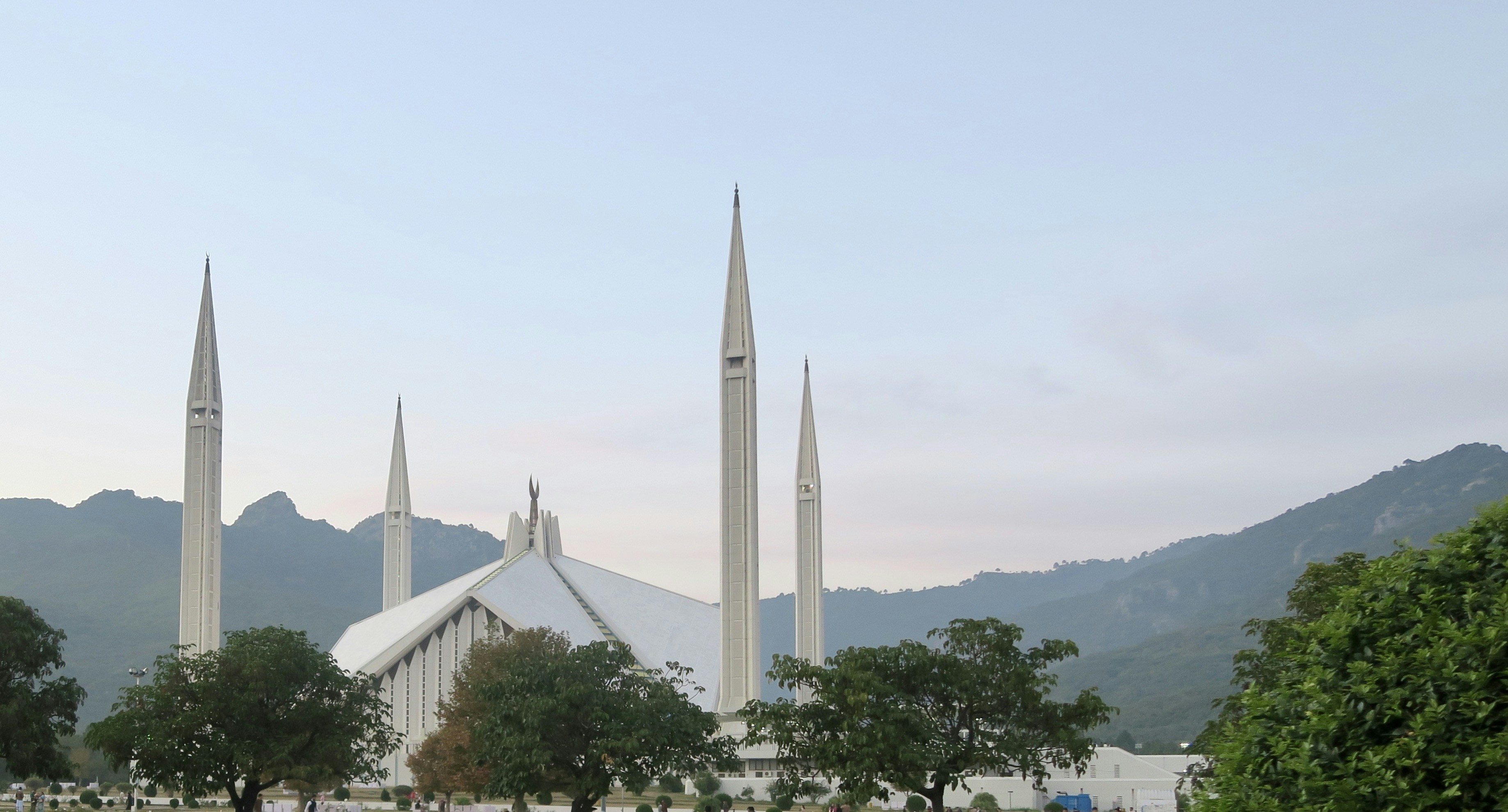 Temple of Peaks: Symmetric Spires above a Modern White Roof
