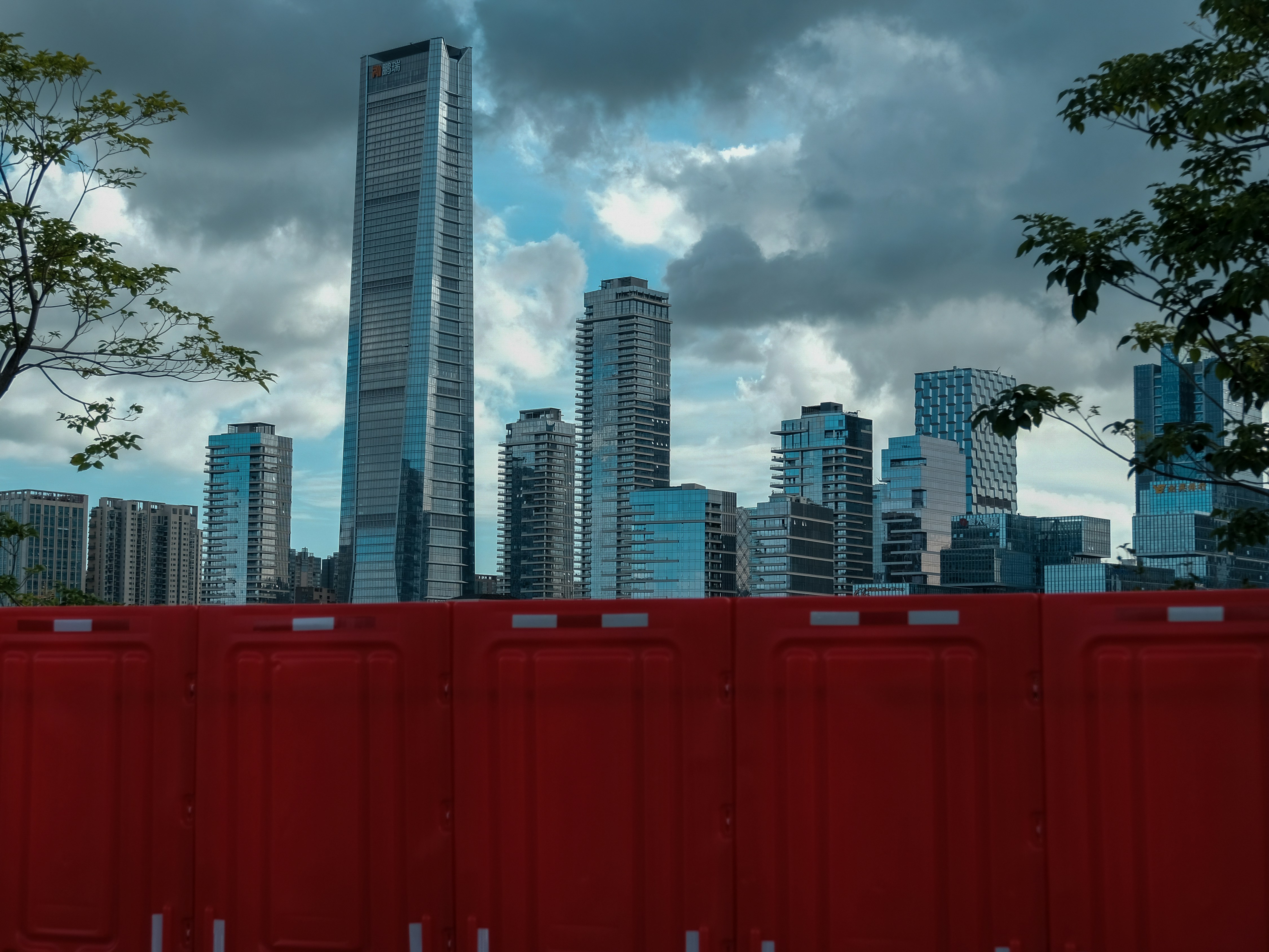City Horizon Above a Red Barricade at Dusk