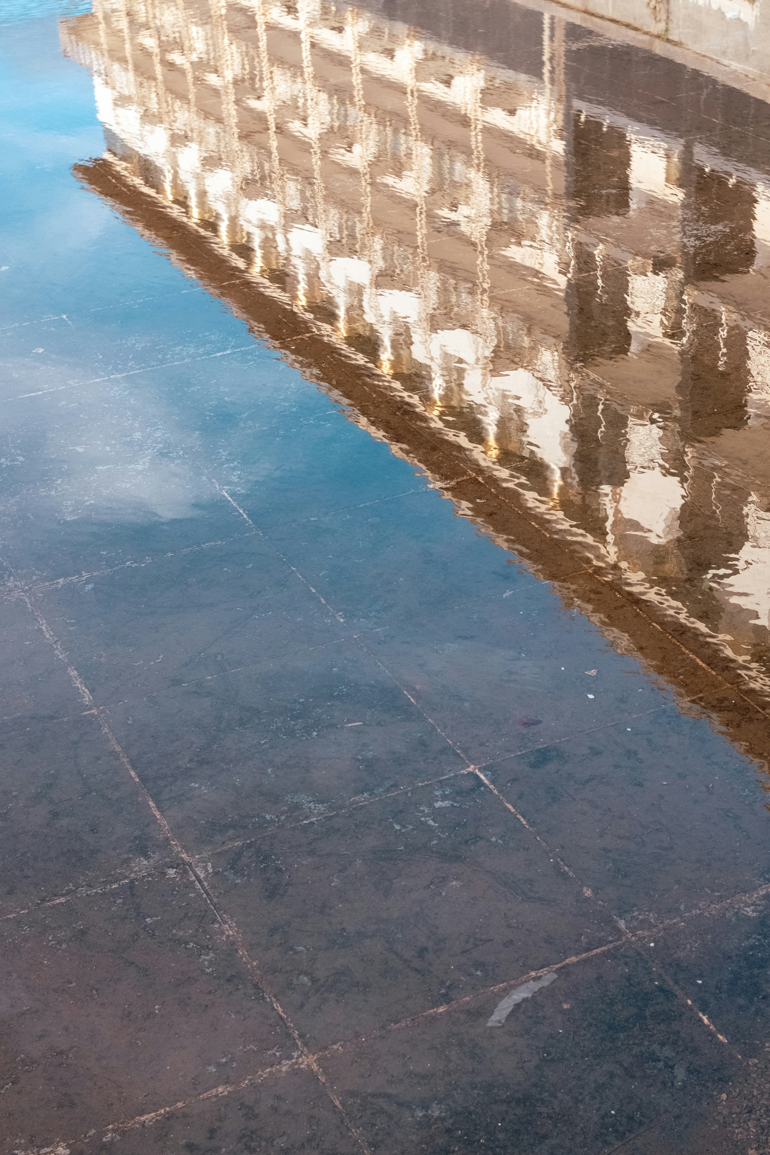 Reflected Architecture on Wet Granite