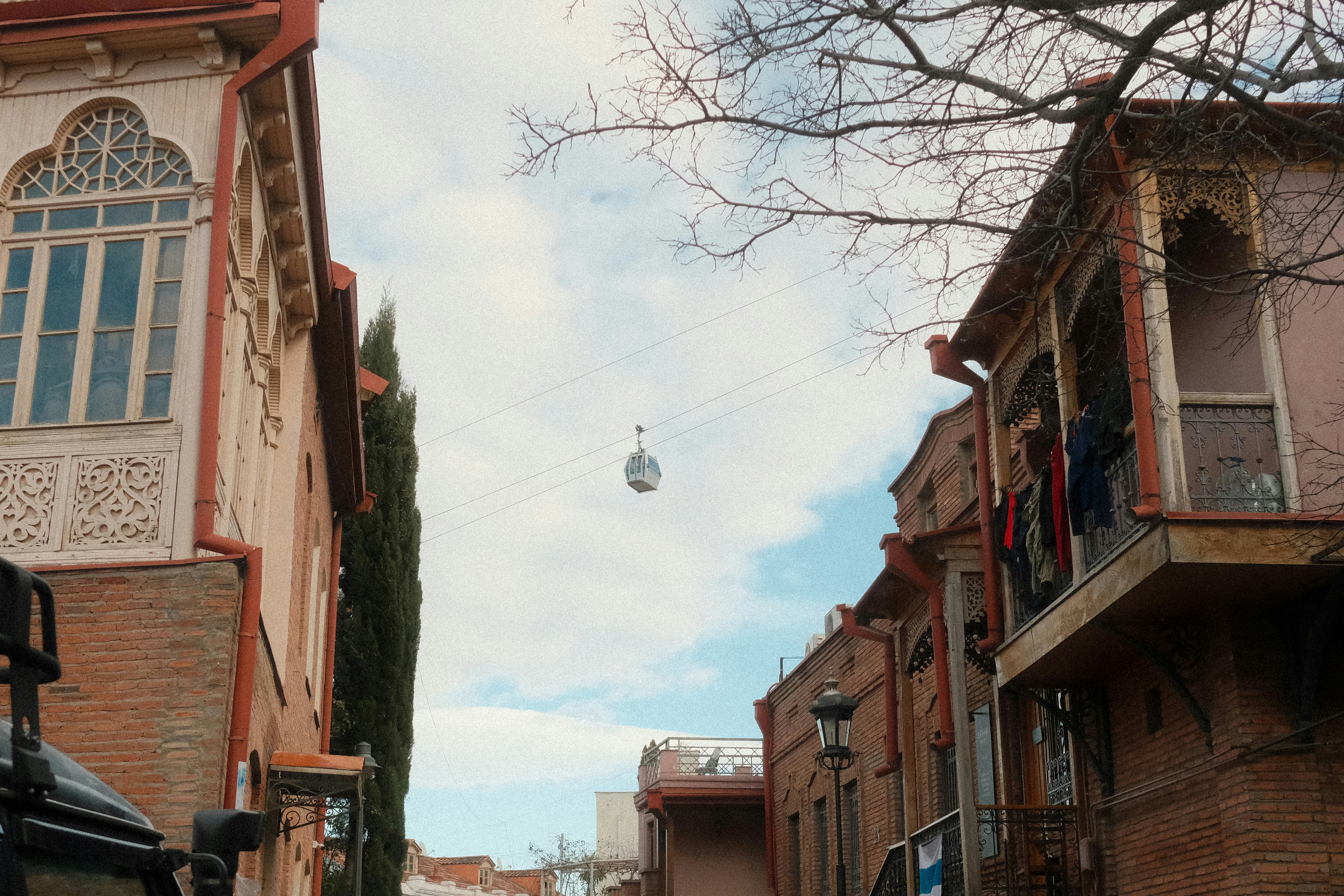 Cable Car Above the Narrow Caucasus Lane