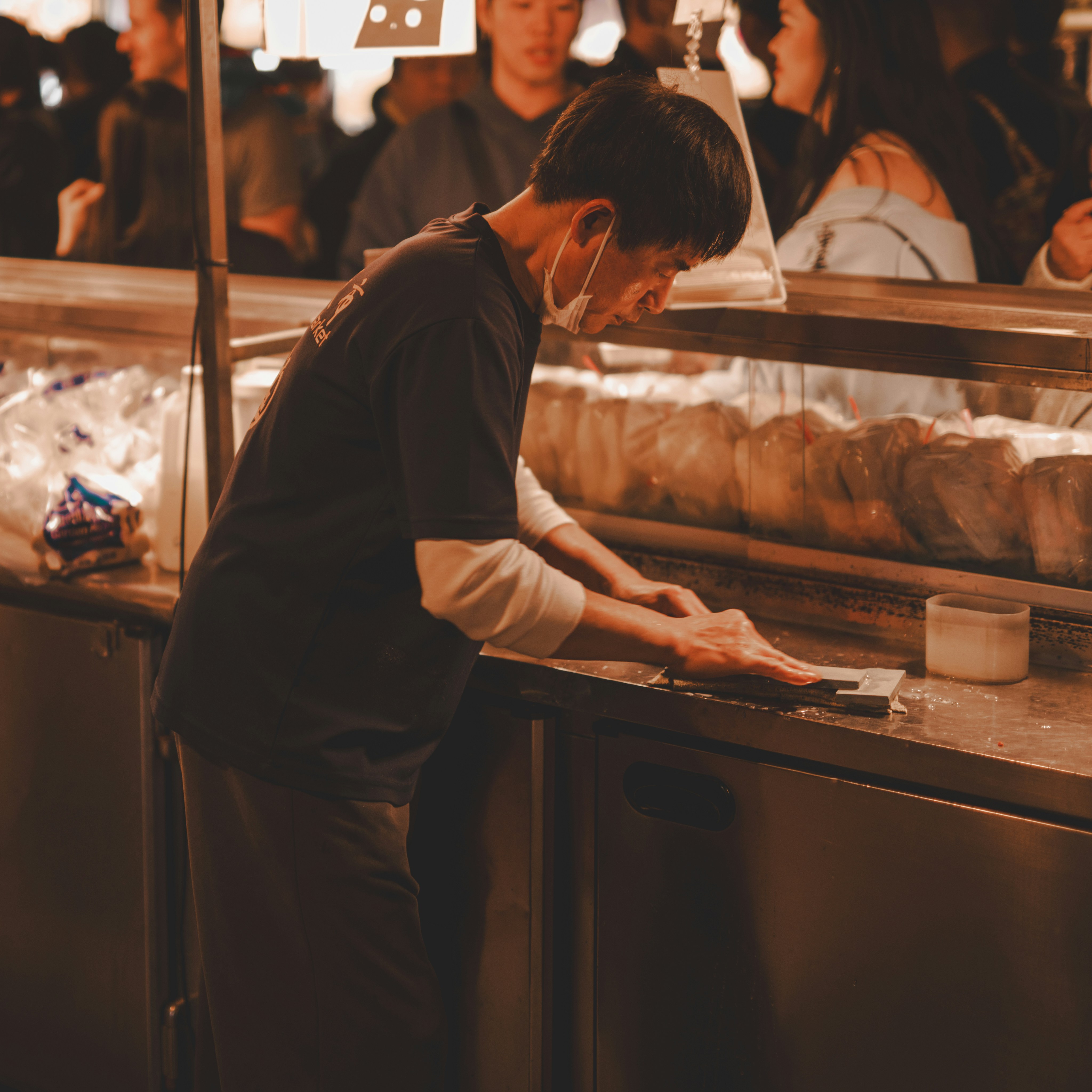 Focused Hands: A Food-worker in a Warm Kitchen Reflecting on Craft