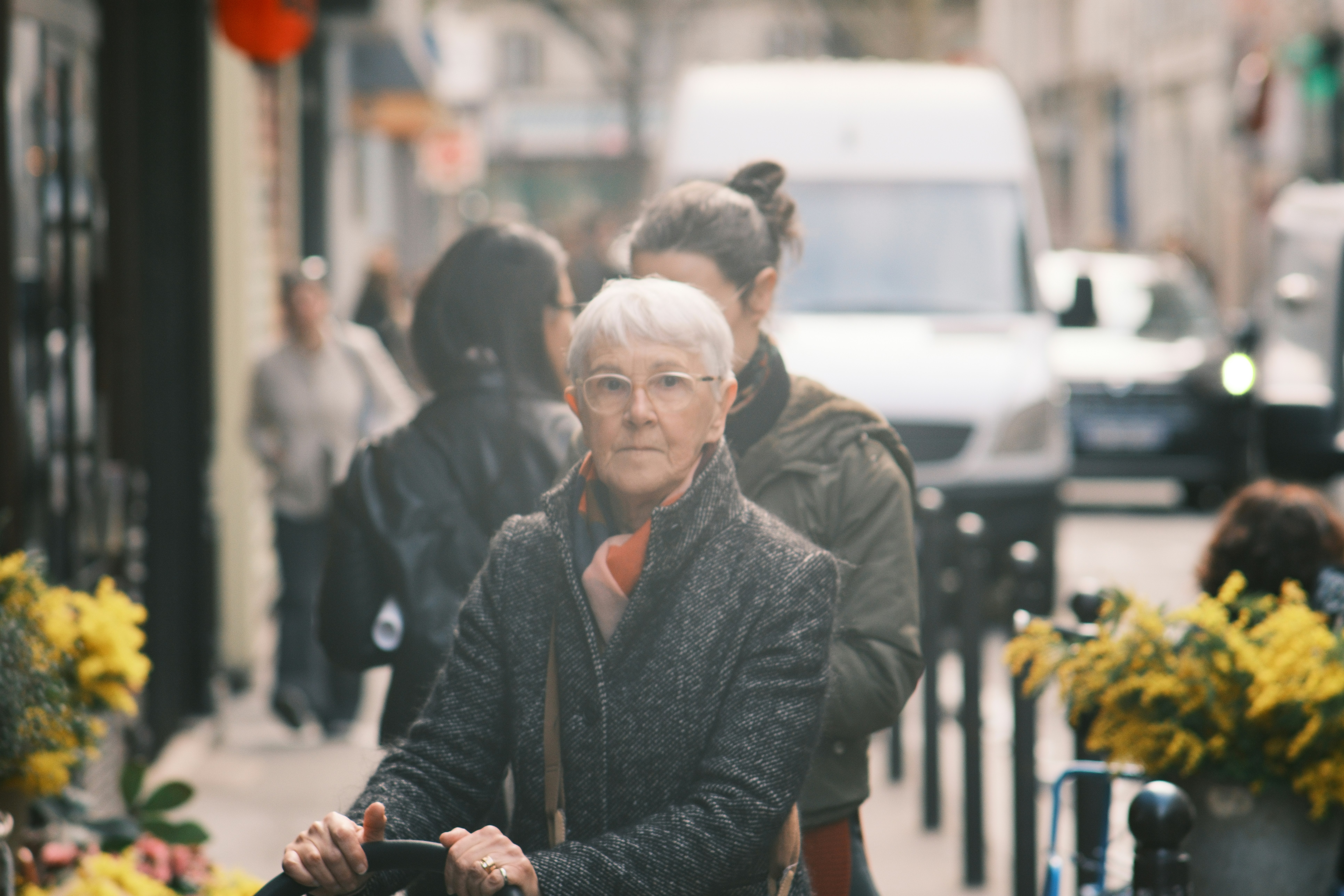 Elder on a City Bicycle Amid Busy Street Fragments
