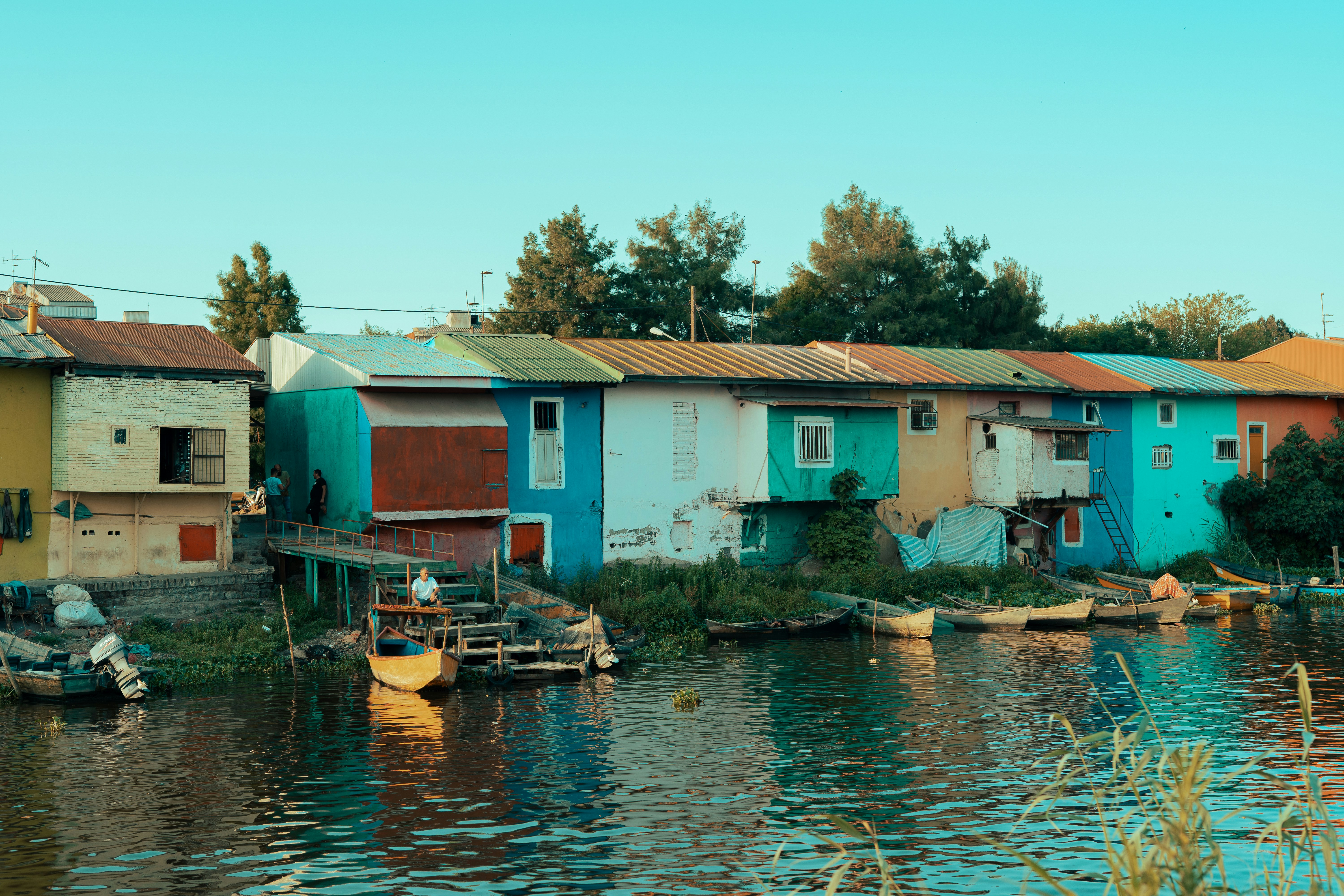 Colorful riverside village afloat on sunlight