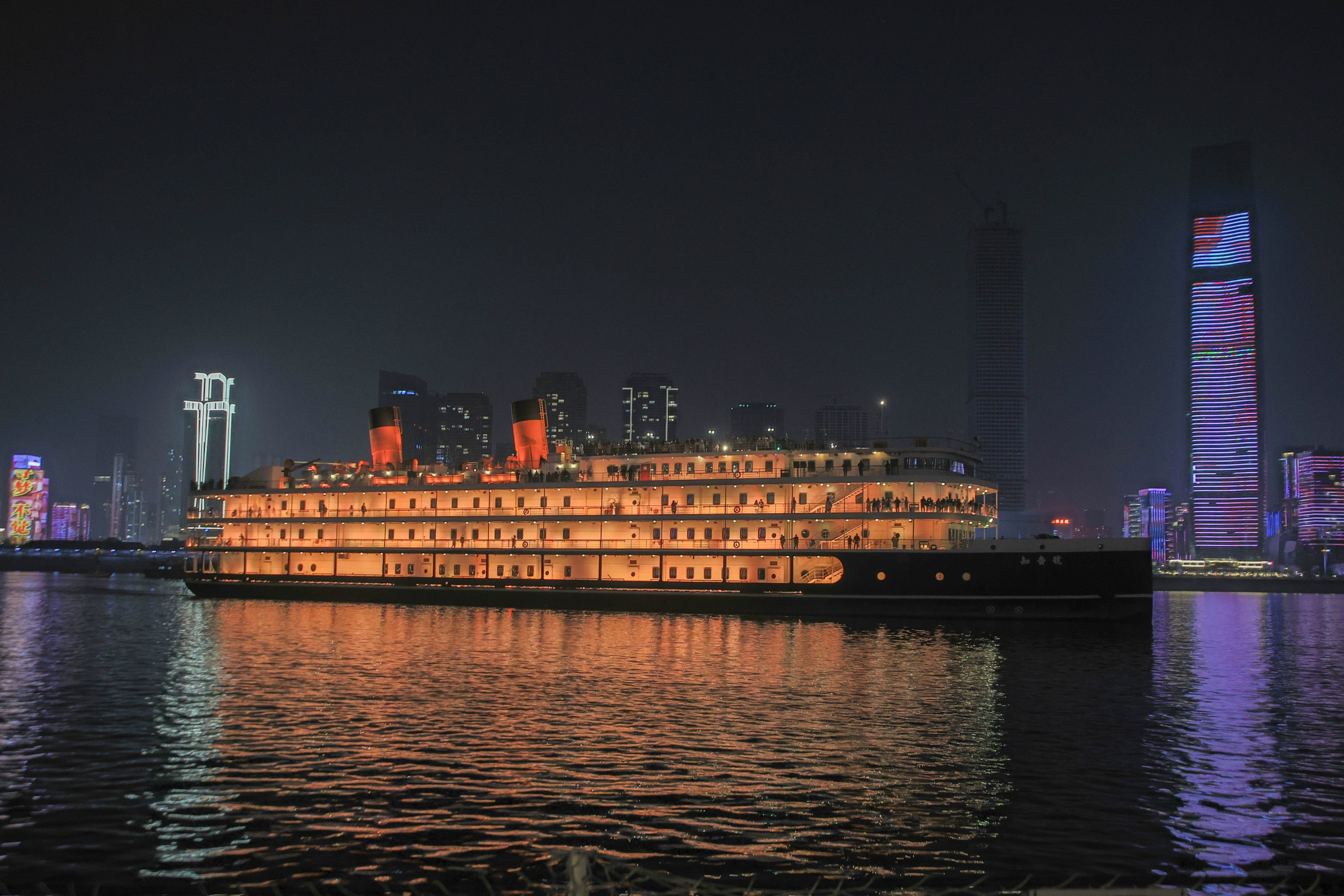 Nighttime Boat Serenade on a Neon Harbor