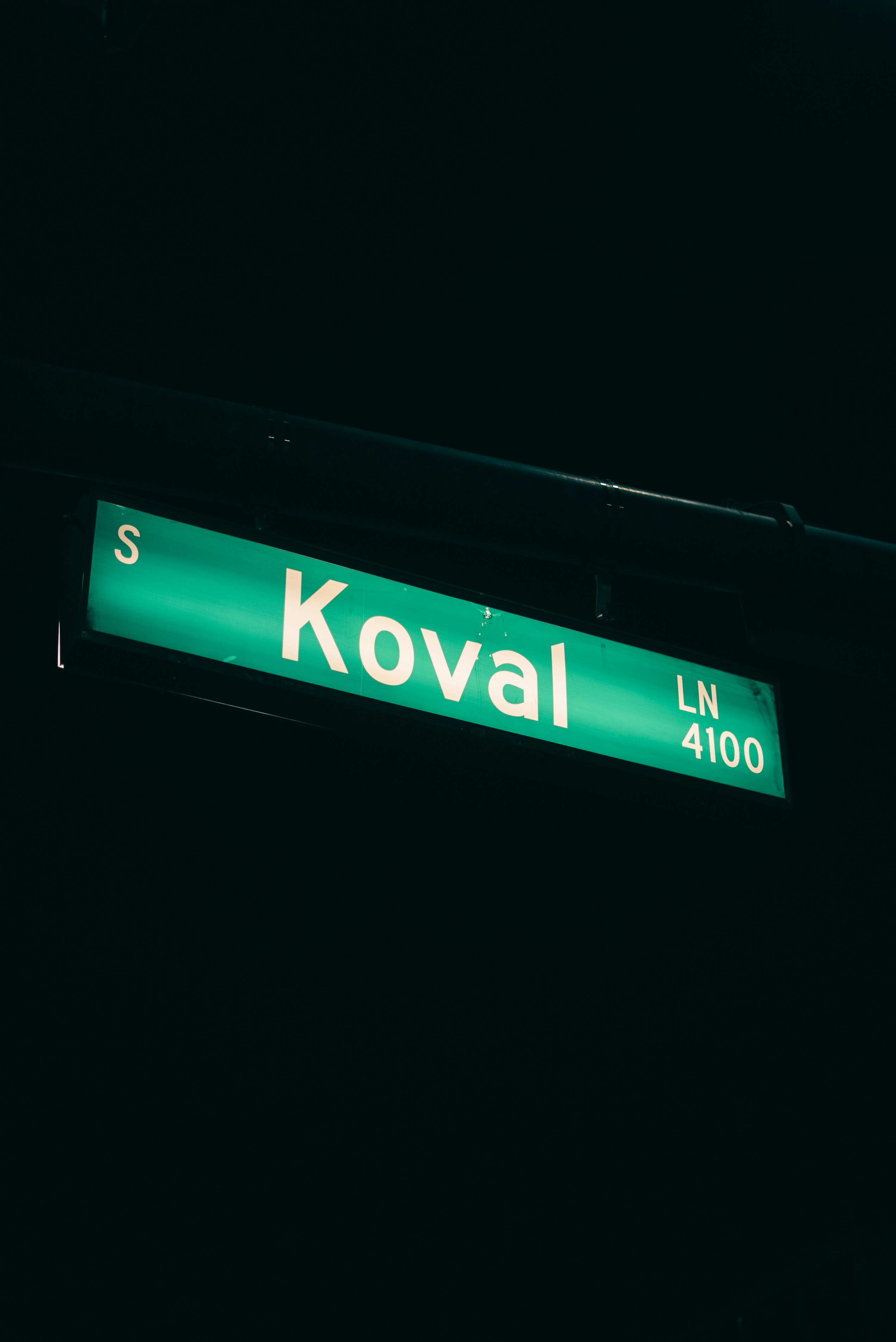 Green Signpost at Night: Koval Station