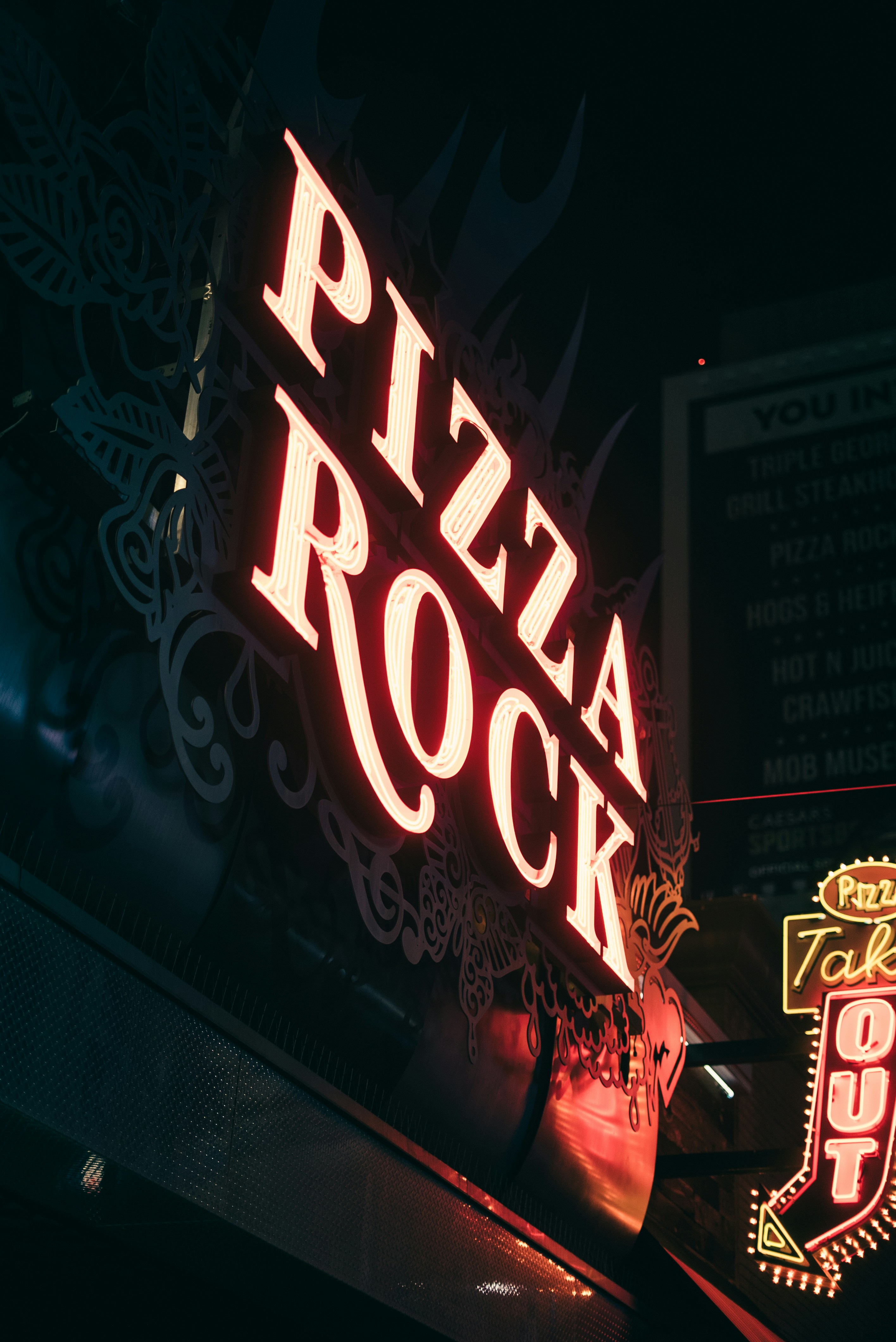 Neon Pizza Rock at City Night