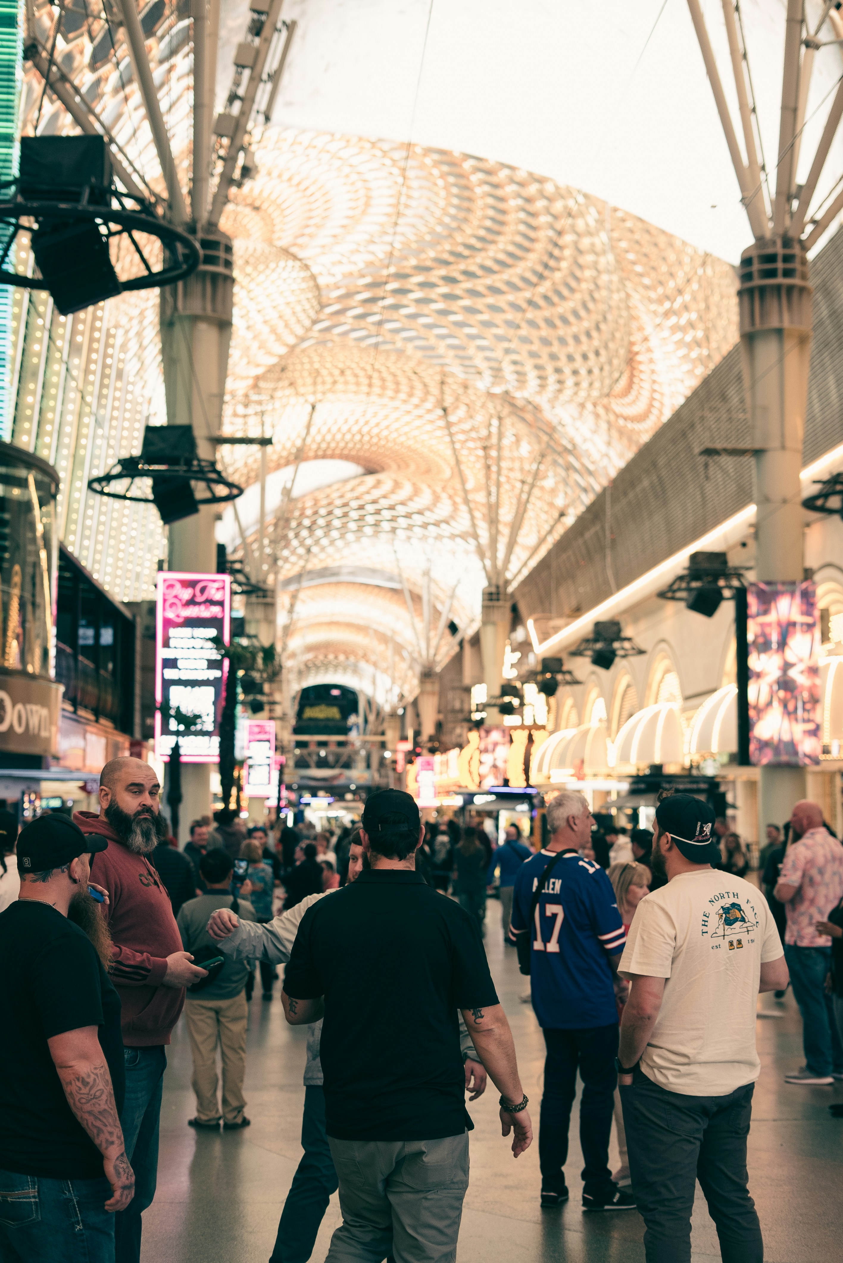 Crowd at a Modern Indoor Market Under Arching Canopies