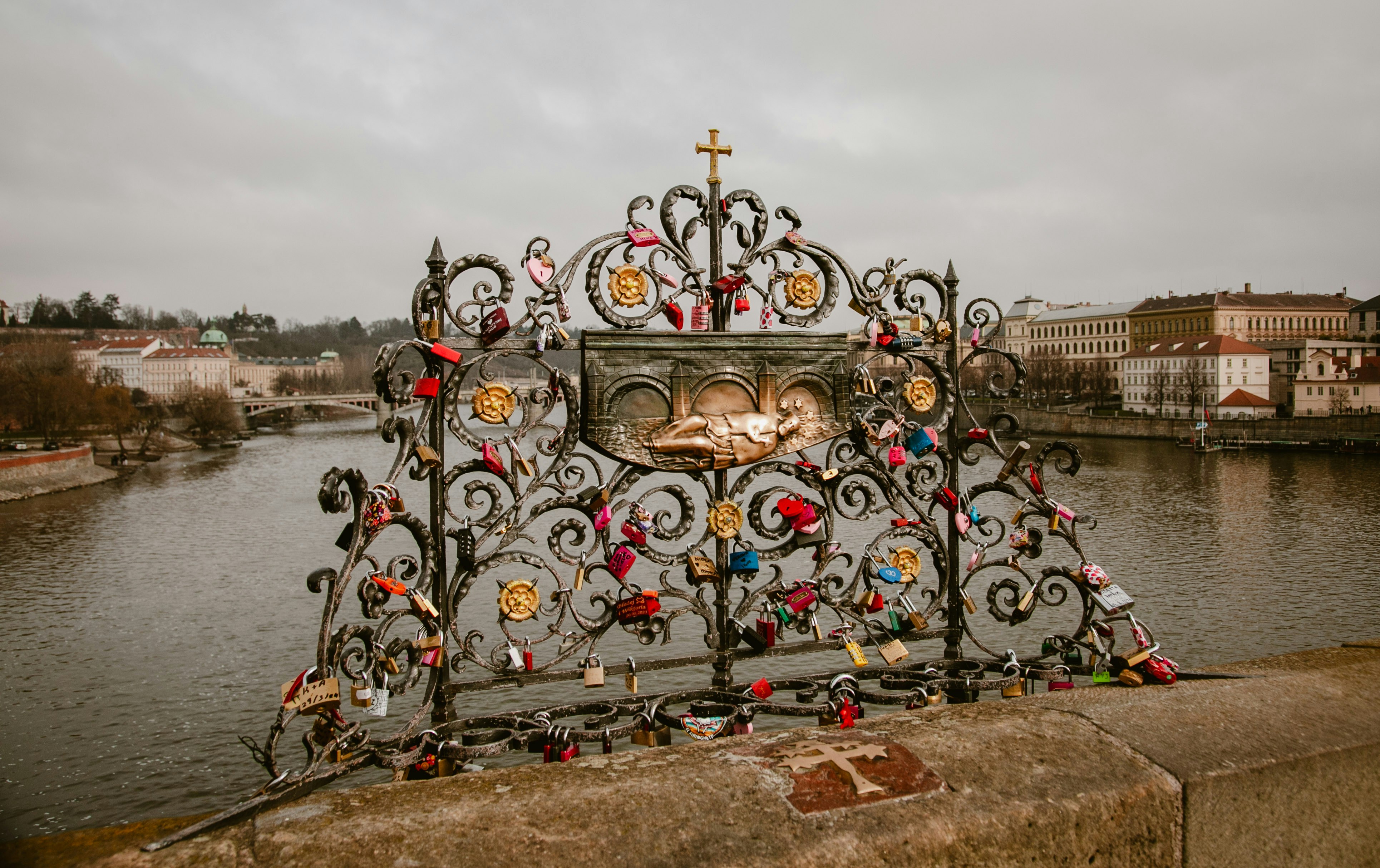 Padlock Garden by the River: A Clasped Heart on a Historic Bridge