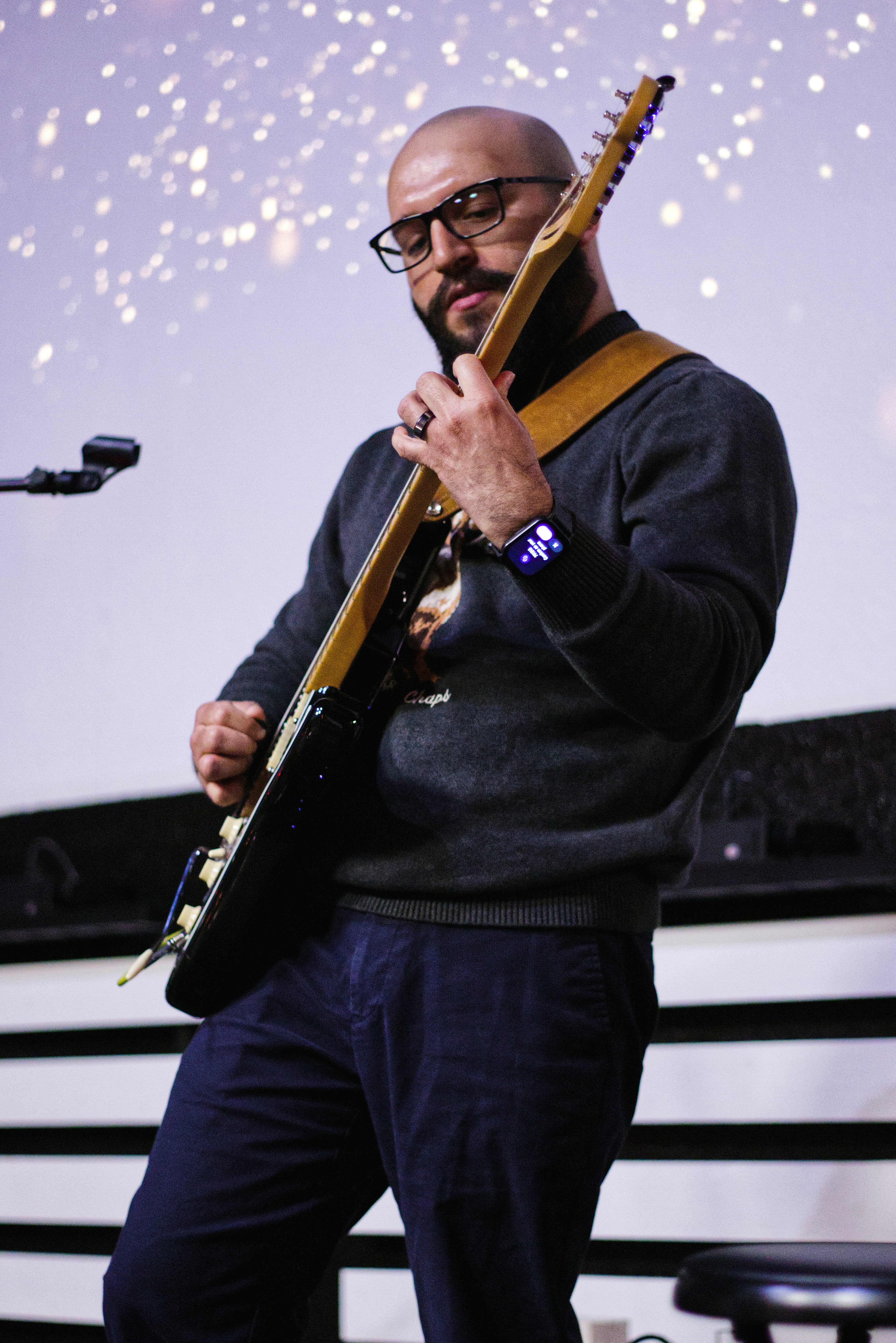 Groove Master in Focus: A Guitarist Under Stage Lights