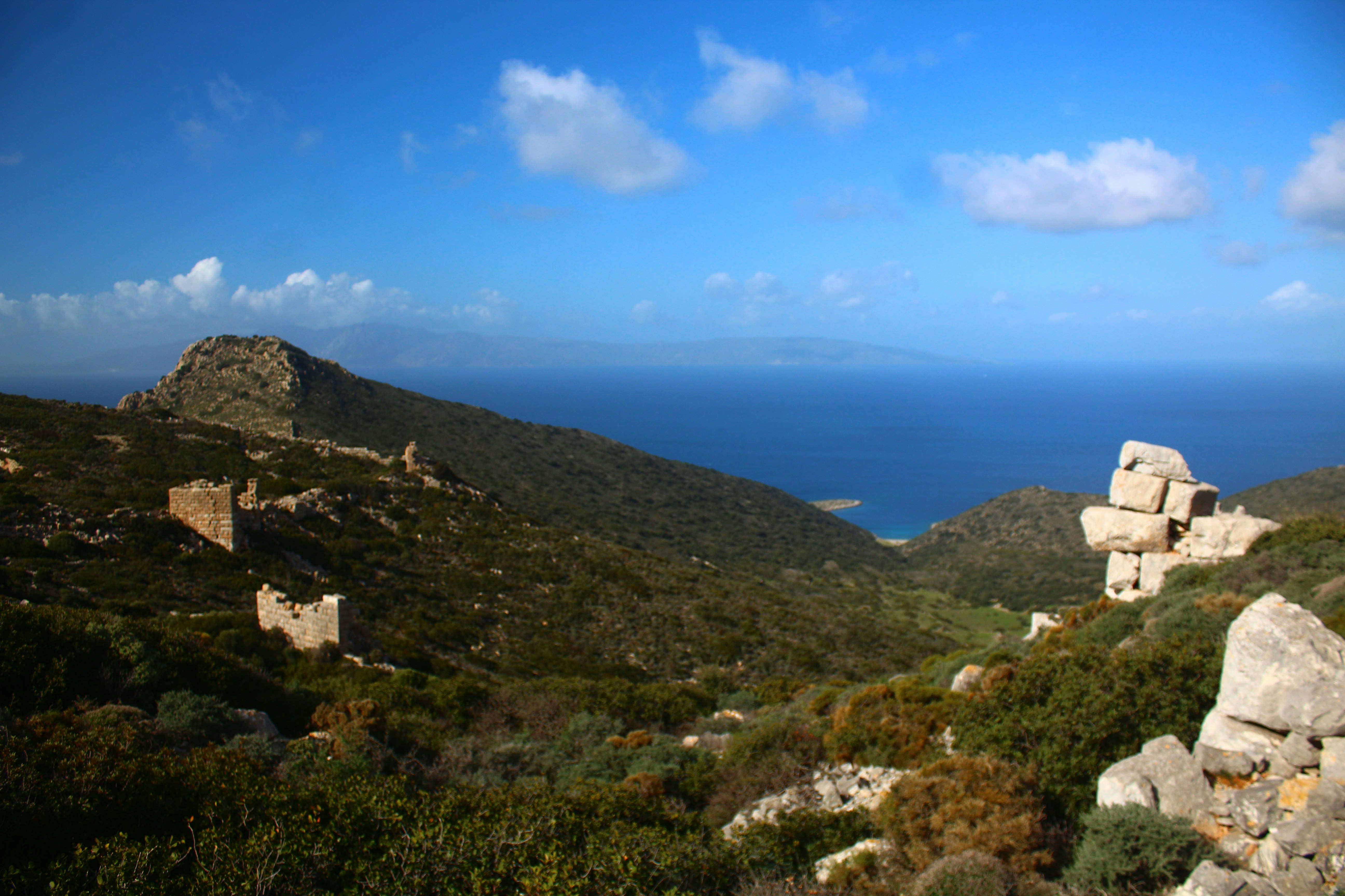 Coastal Ridge and Ancient Stones Under a Clear Sky