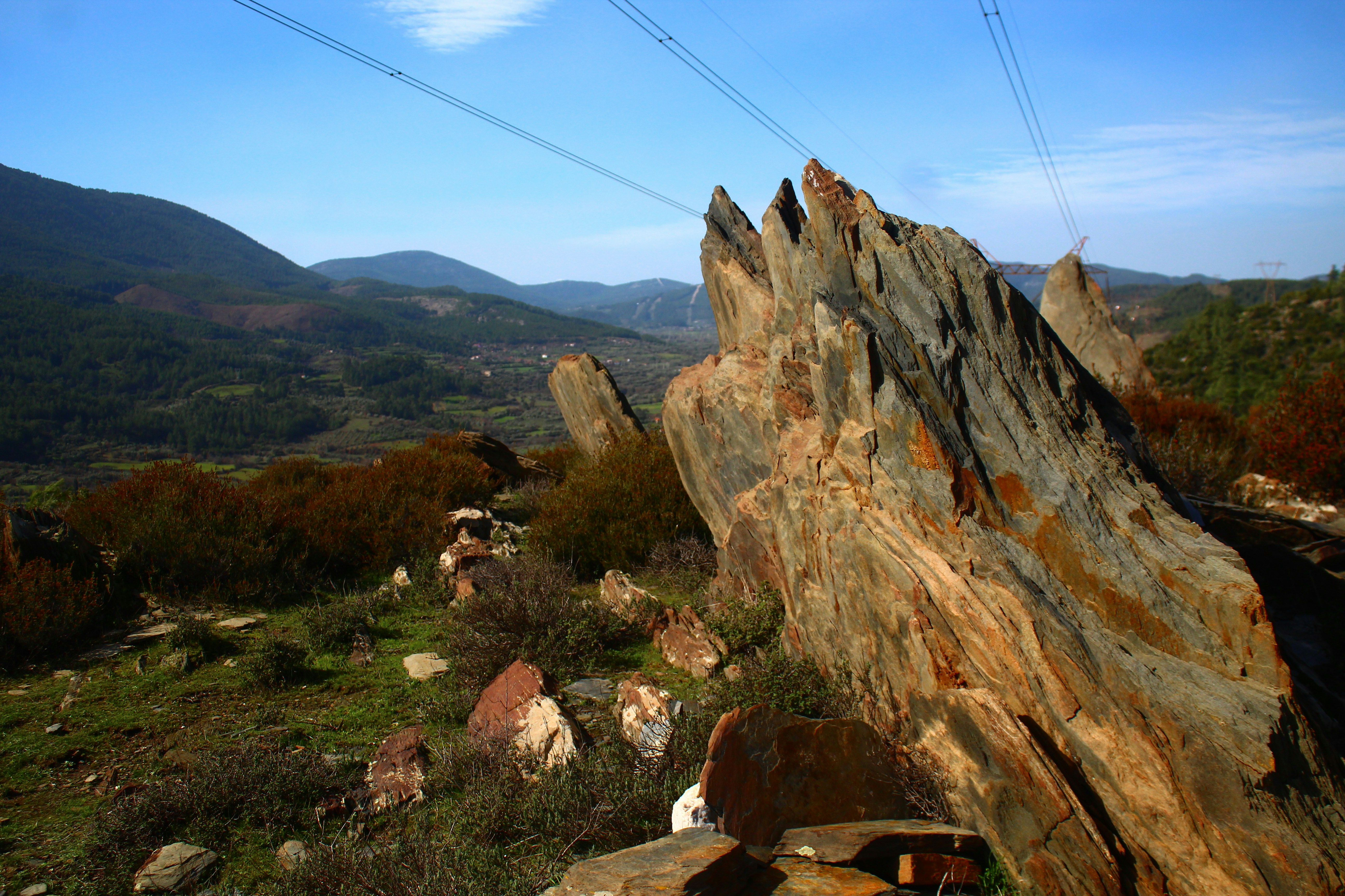 Stone Spine in a valley: jagged rock formation under blue skies