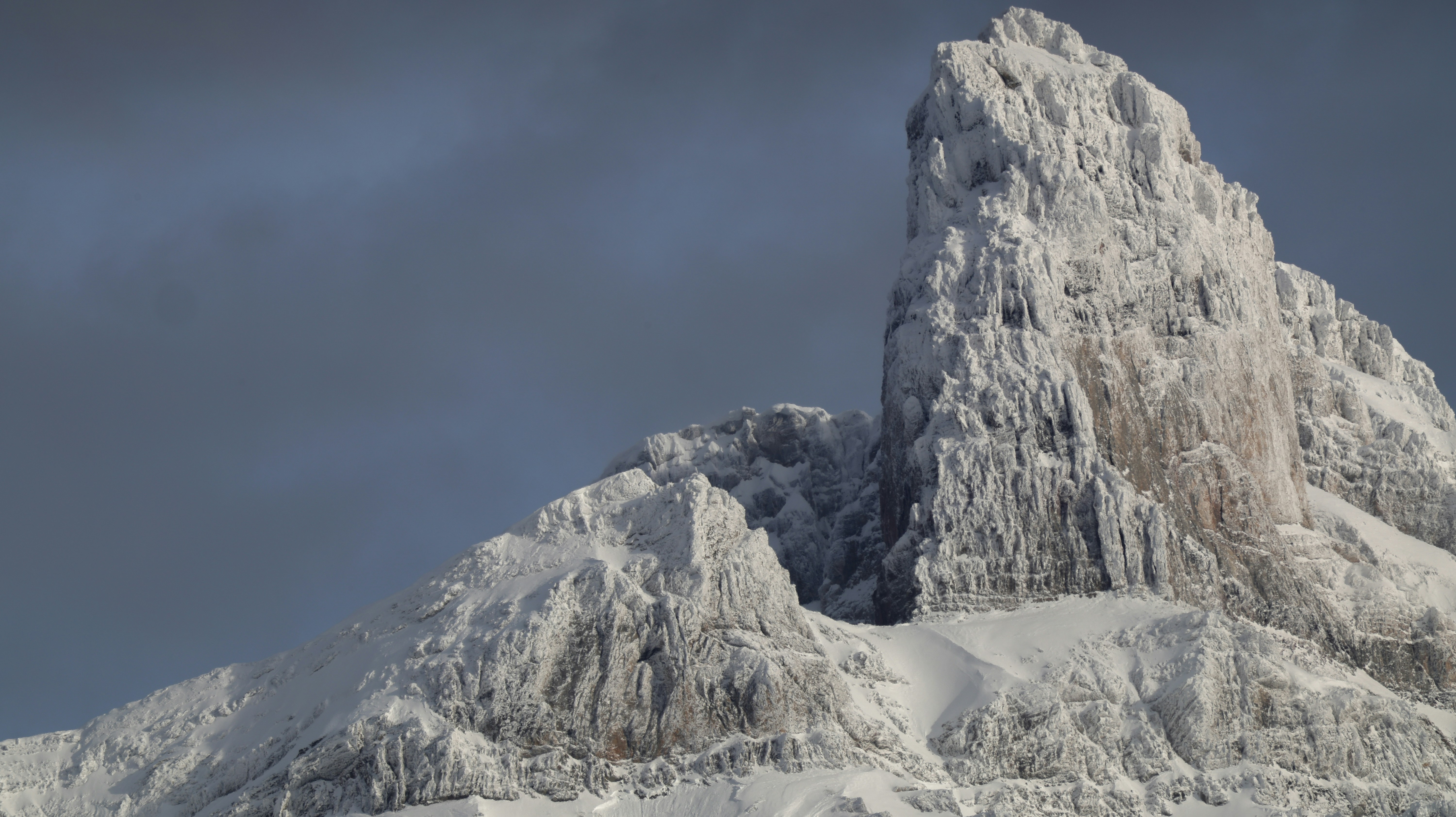 Snowbound Needle: A Concrete Peak Piercing the Sky