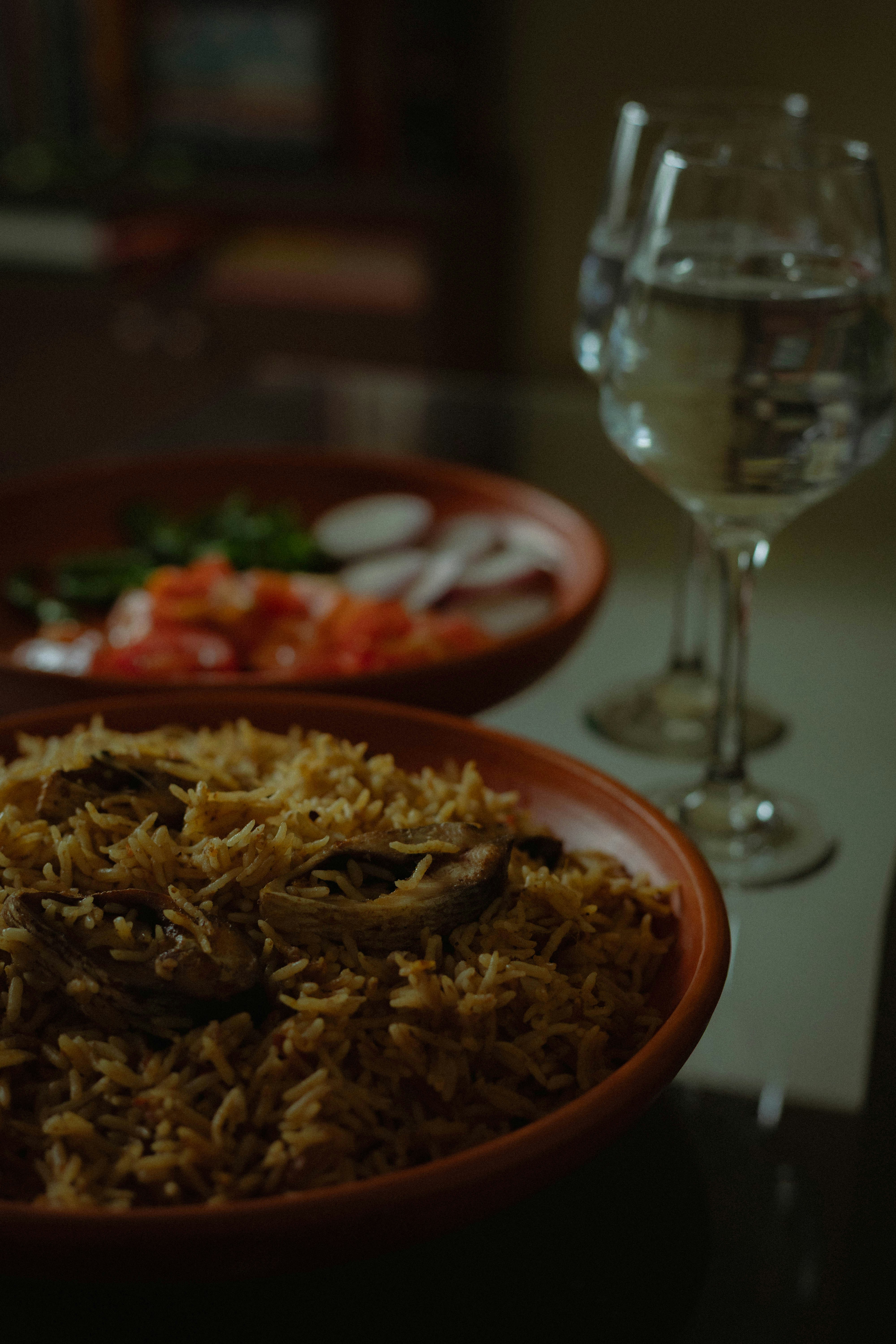 Savory steam and glass: a dinner scene with rice and wine