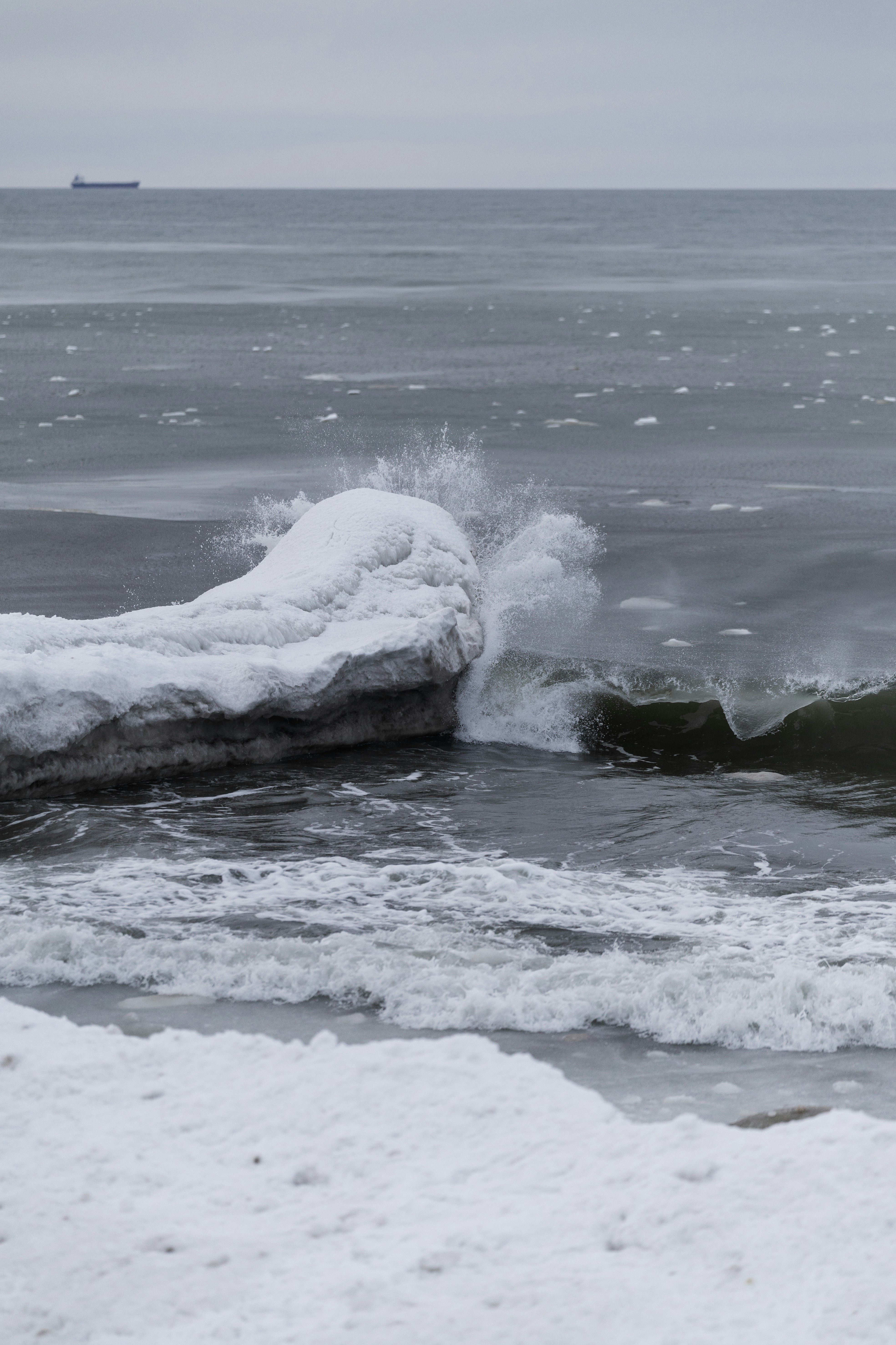 Foamy Arctic Wake Against a Distant Ship