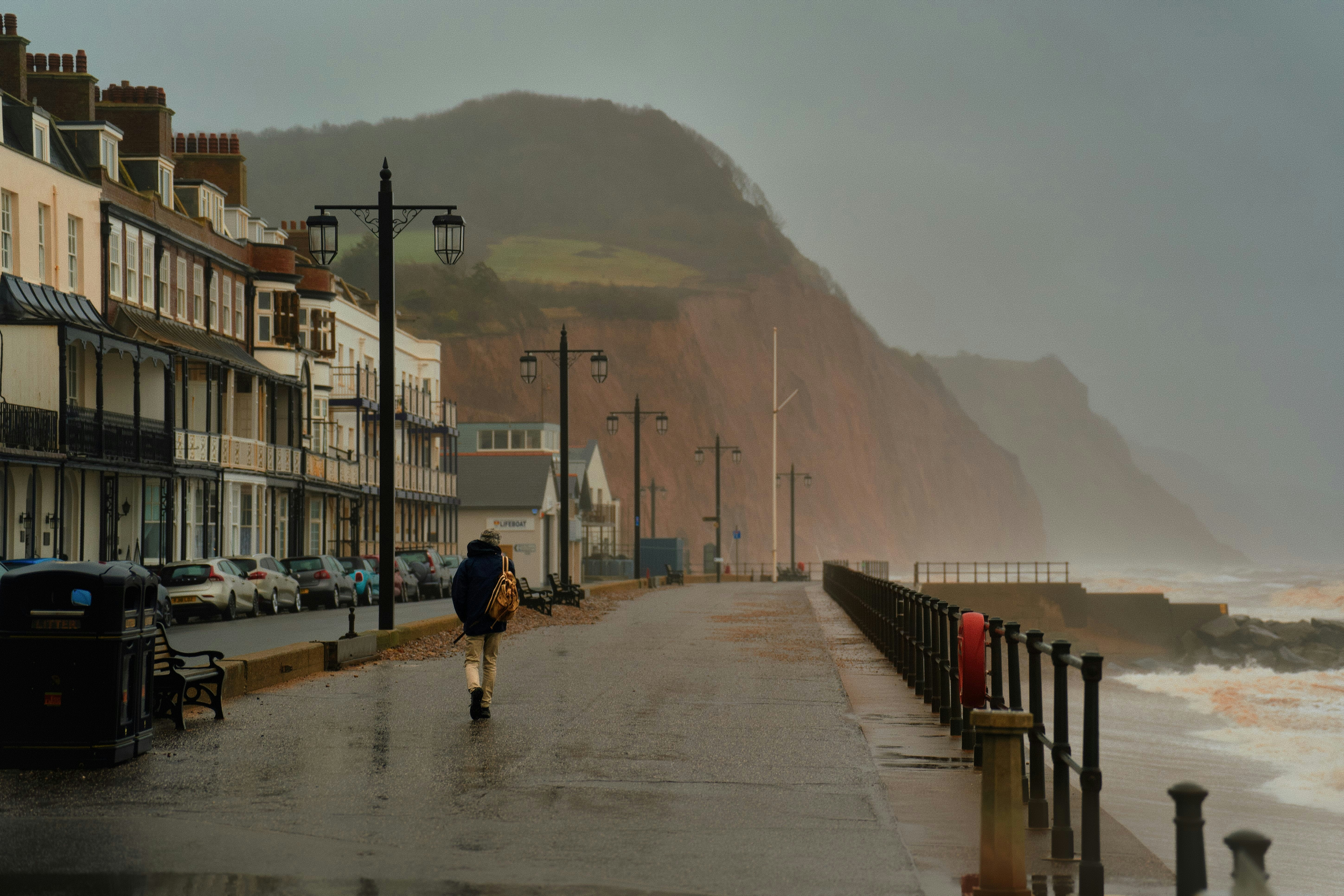 Lonely Stroll Along a Misty Cliffside Promenade