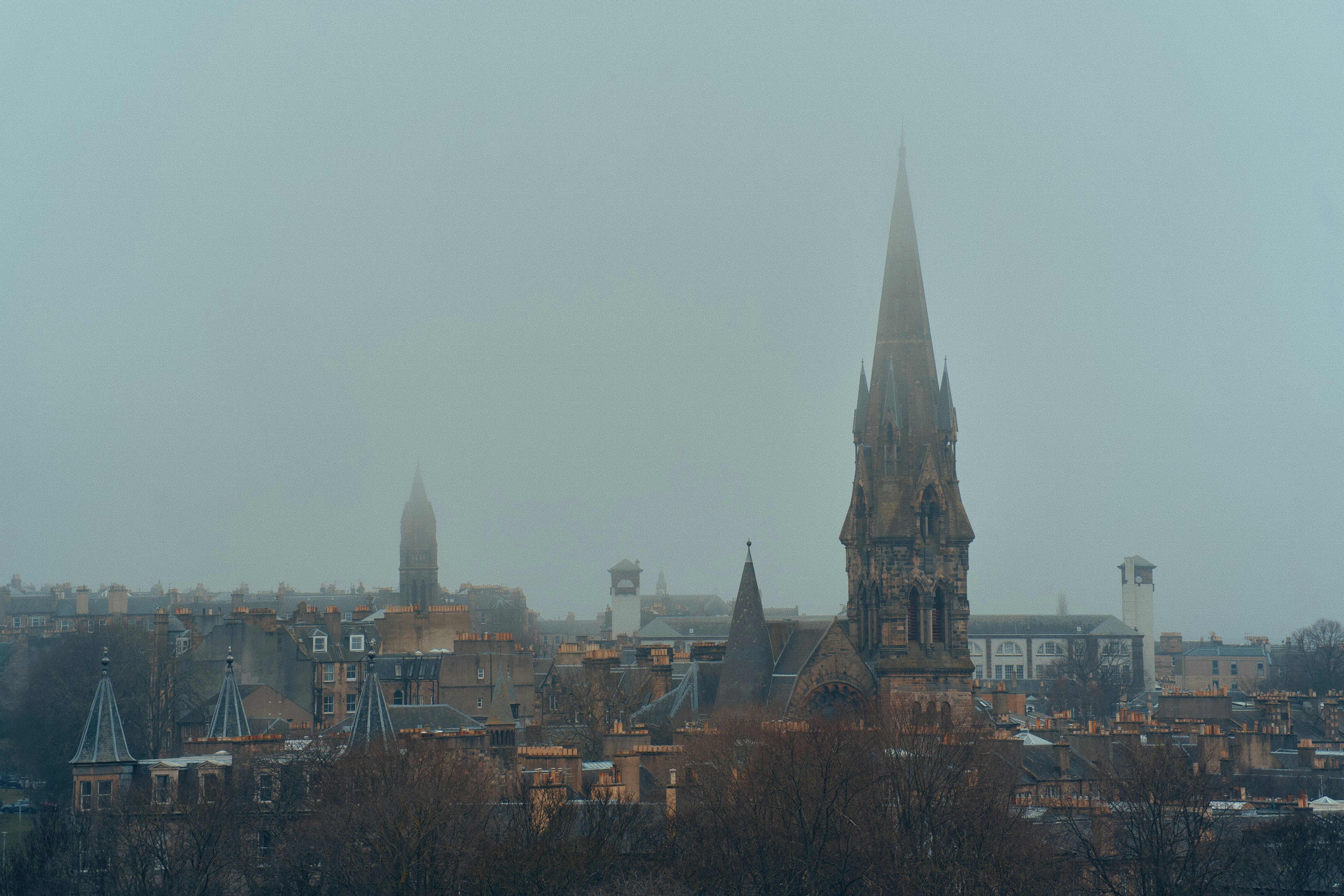 Spire and Stadial Silhouette Beyond Winter Fog