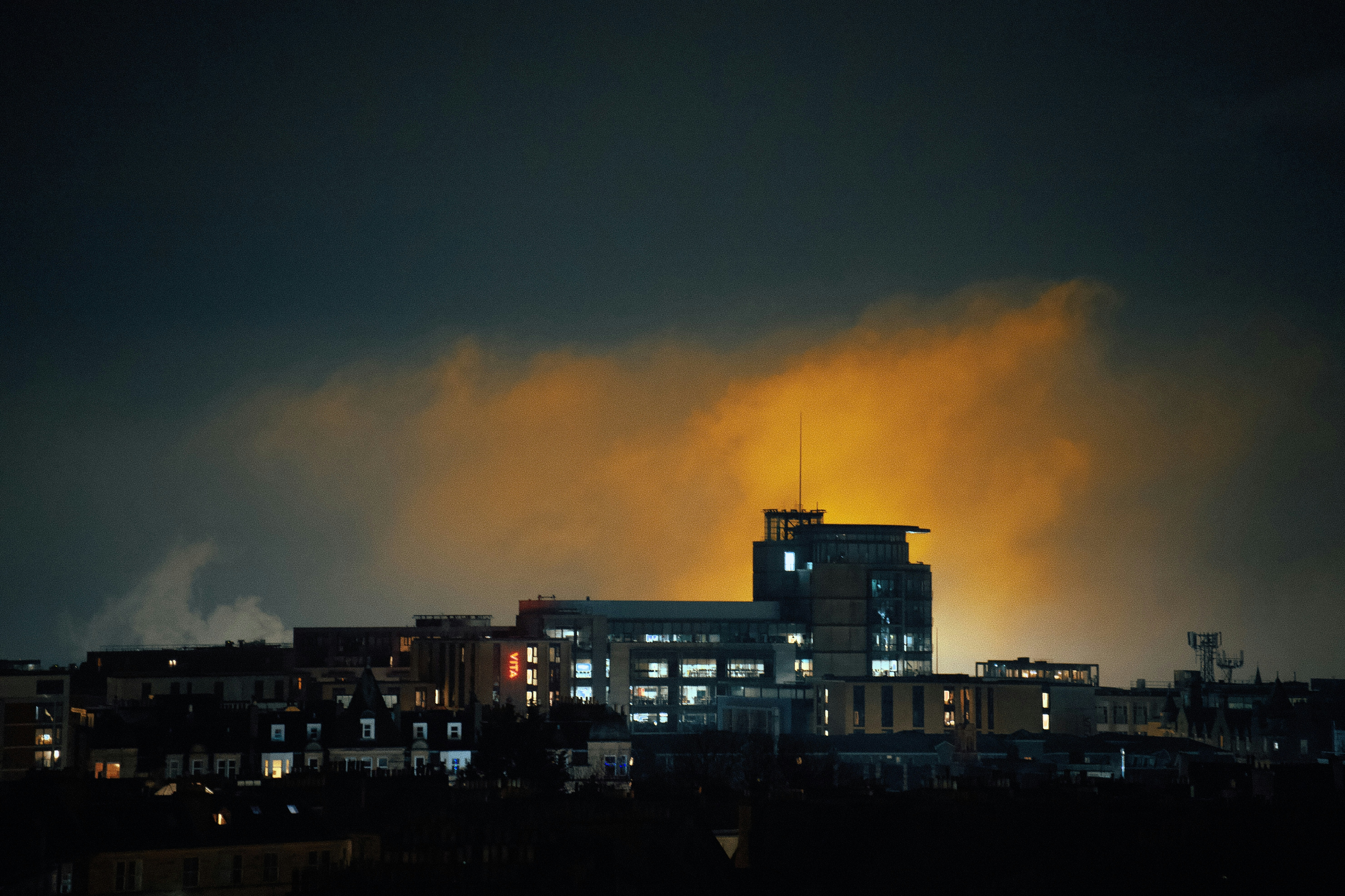 Glowing Ember Above the Urban Edge