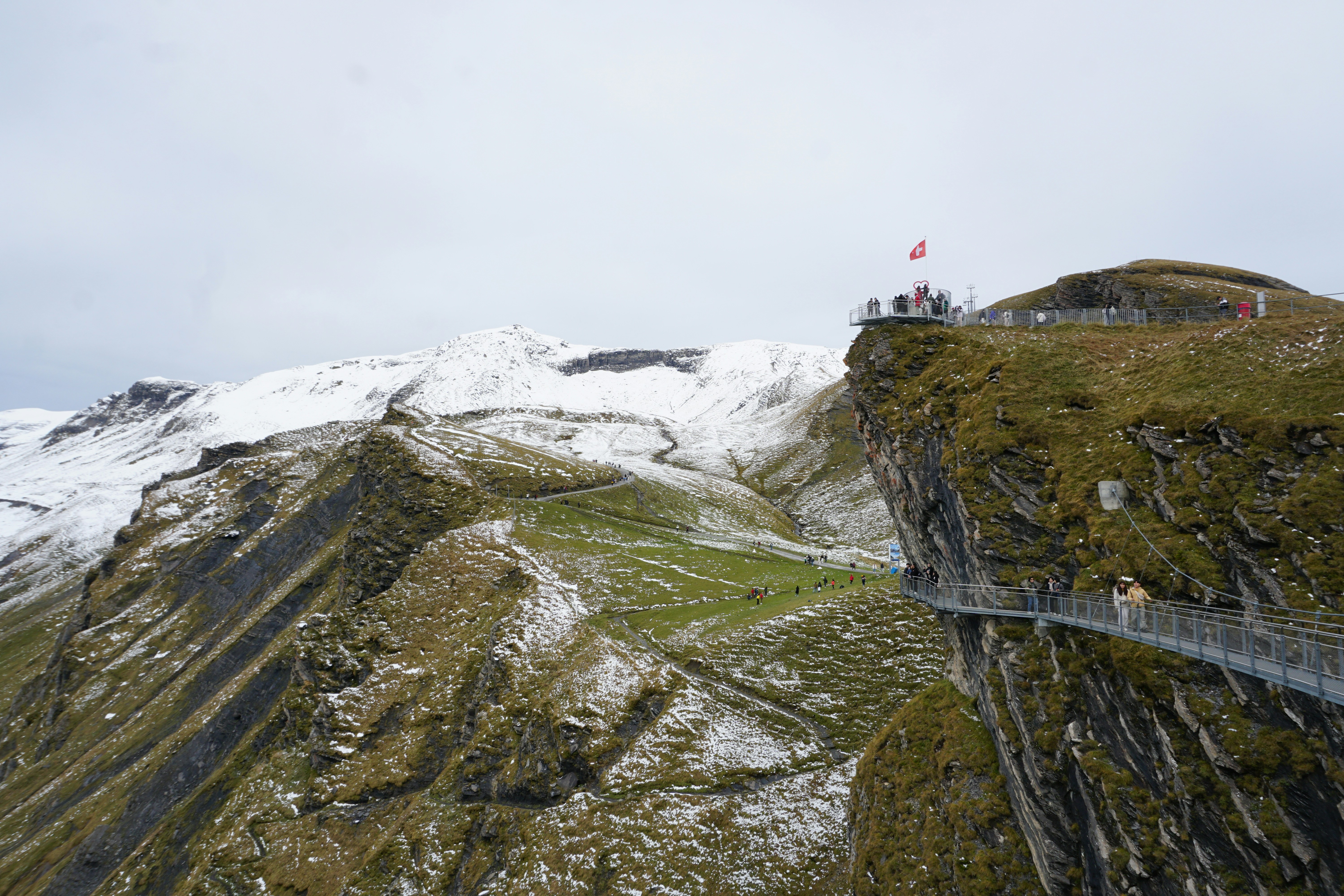Flag on the Rim: A Glassy Cliffside Overlook