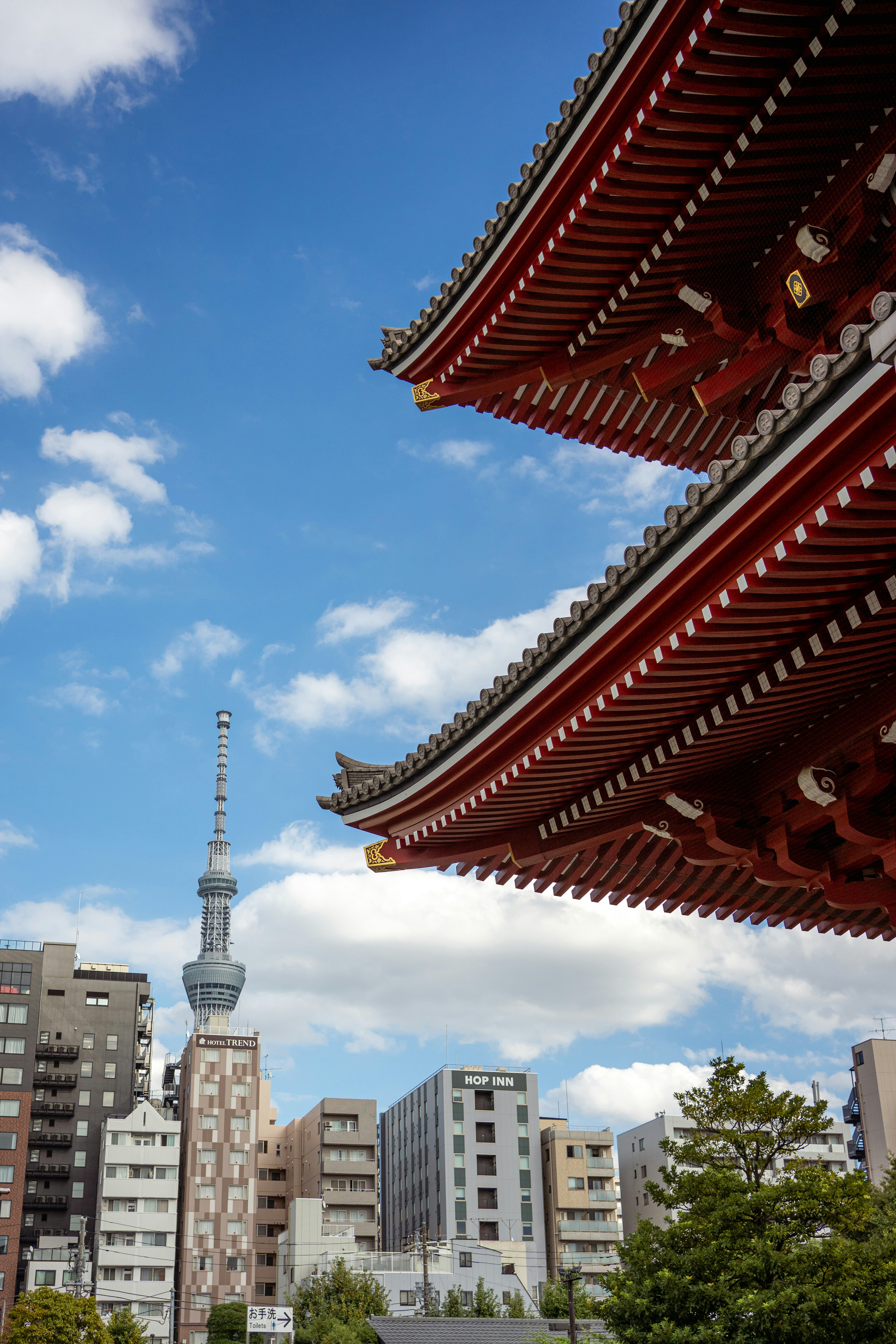 Red Roof, Blue Sky: A Sunrise Over Tokyo Skyscrapers