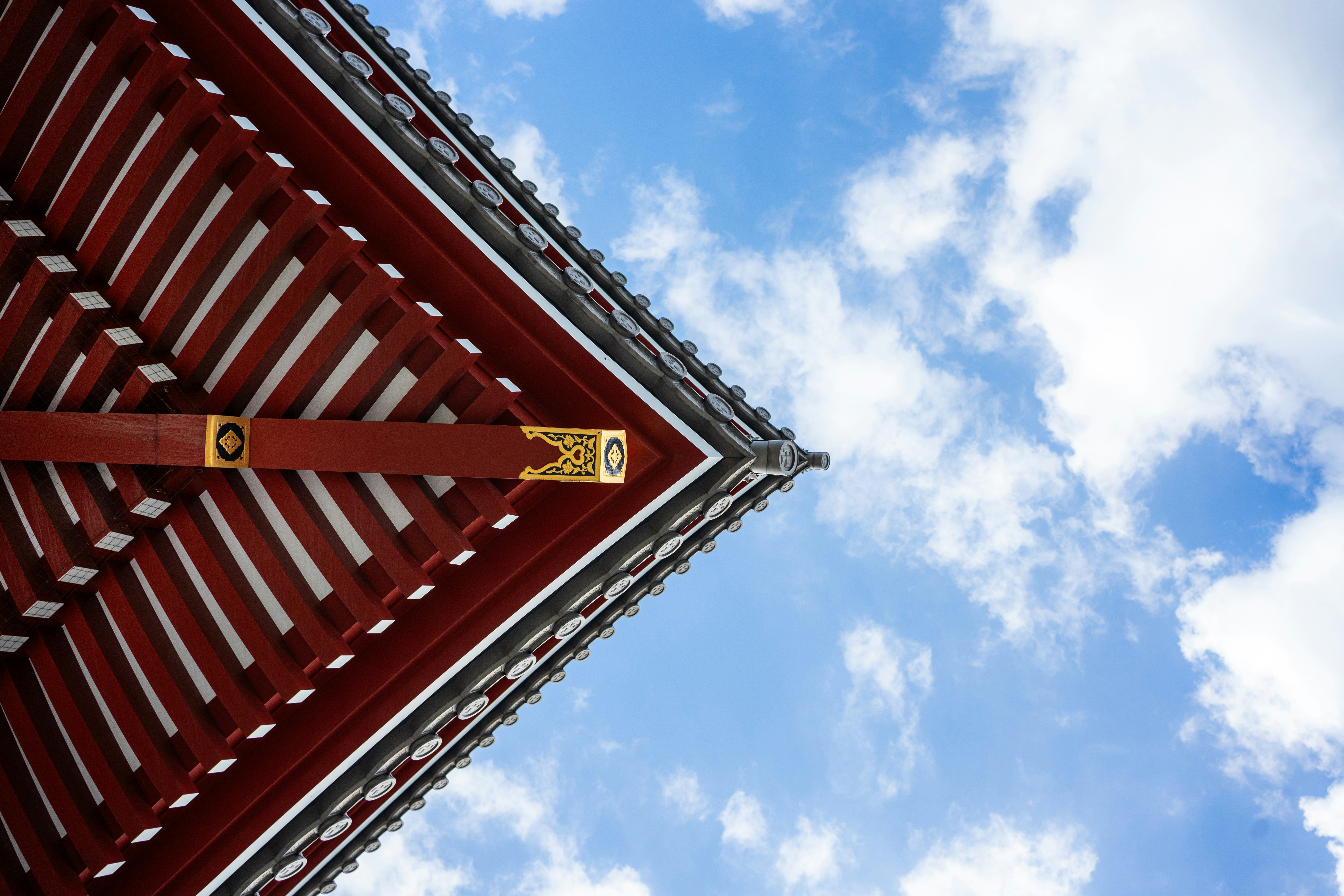 Rising to the Sky: A Lantern-Driven Spire Against a Blue Noon