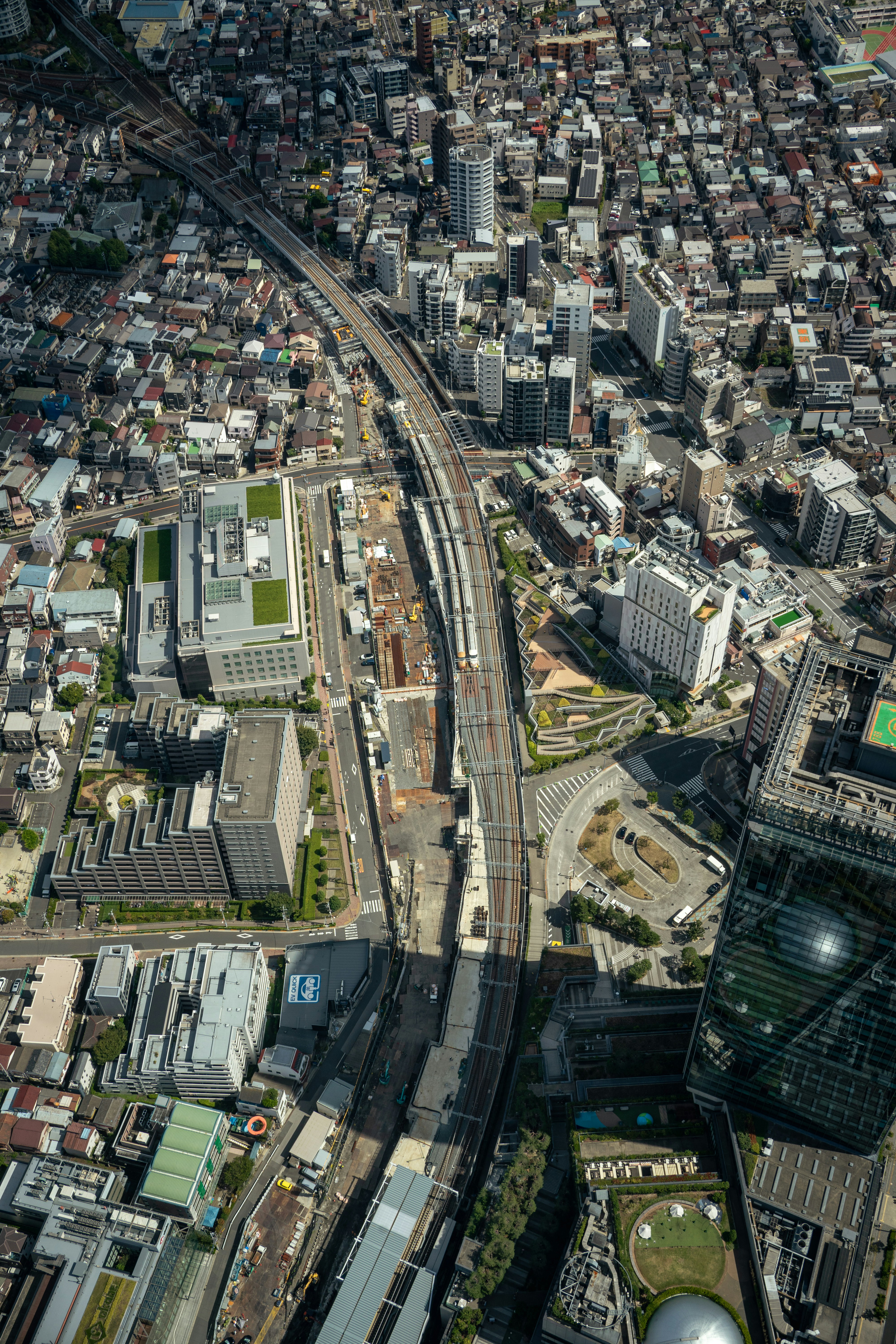 Elevated Rail Arc through a Dense Urban Grid