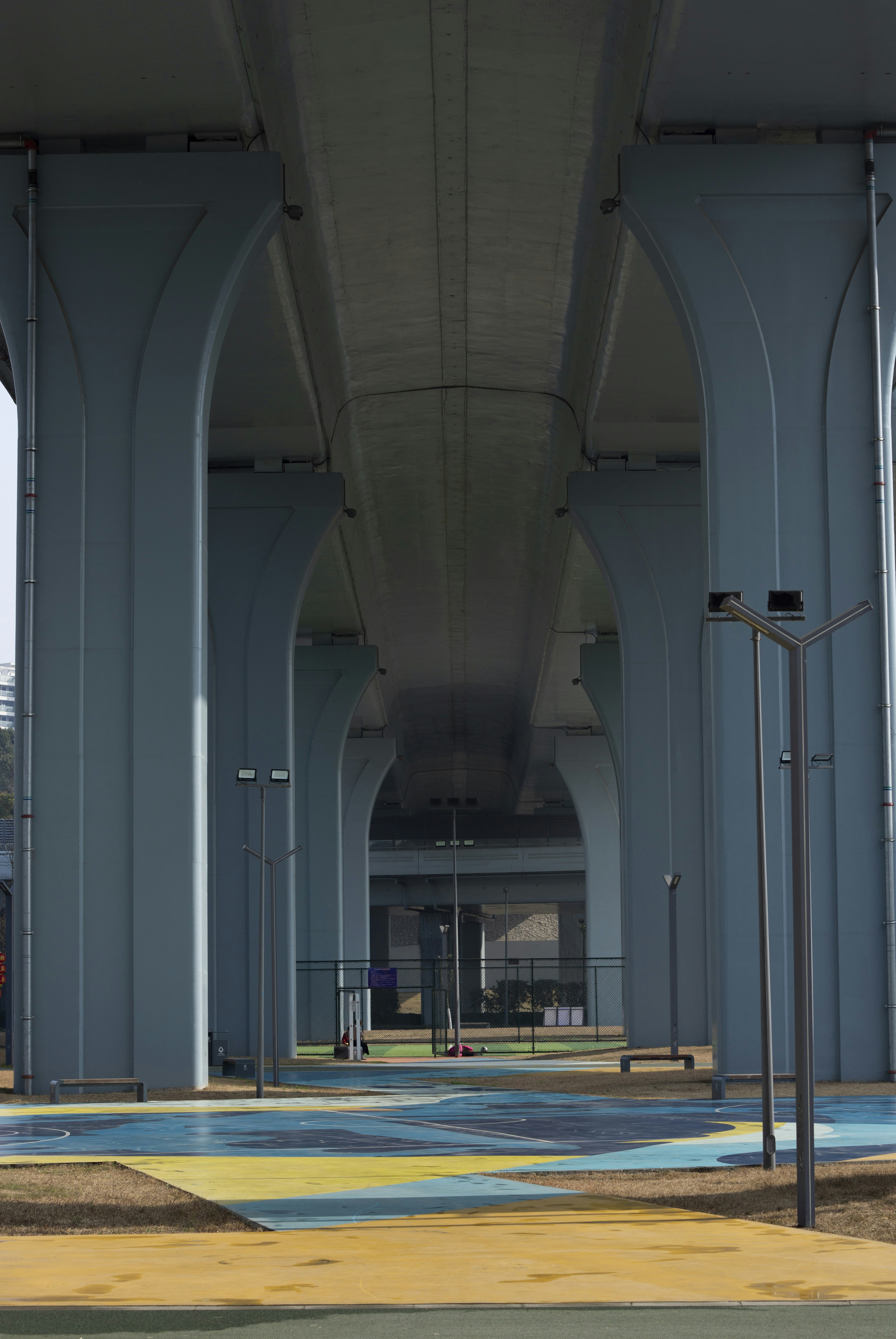 Under the Concrete Arches: A Perspective Through the Pillars